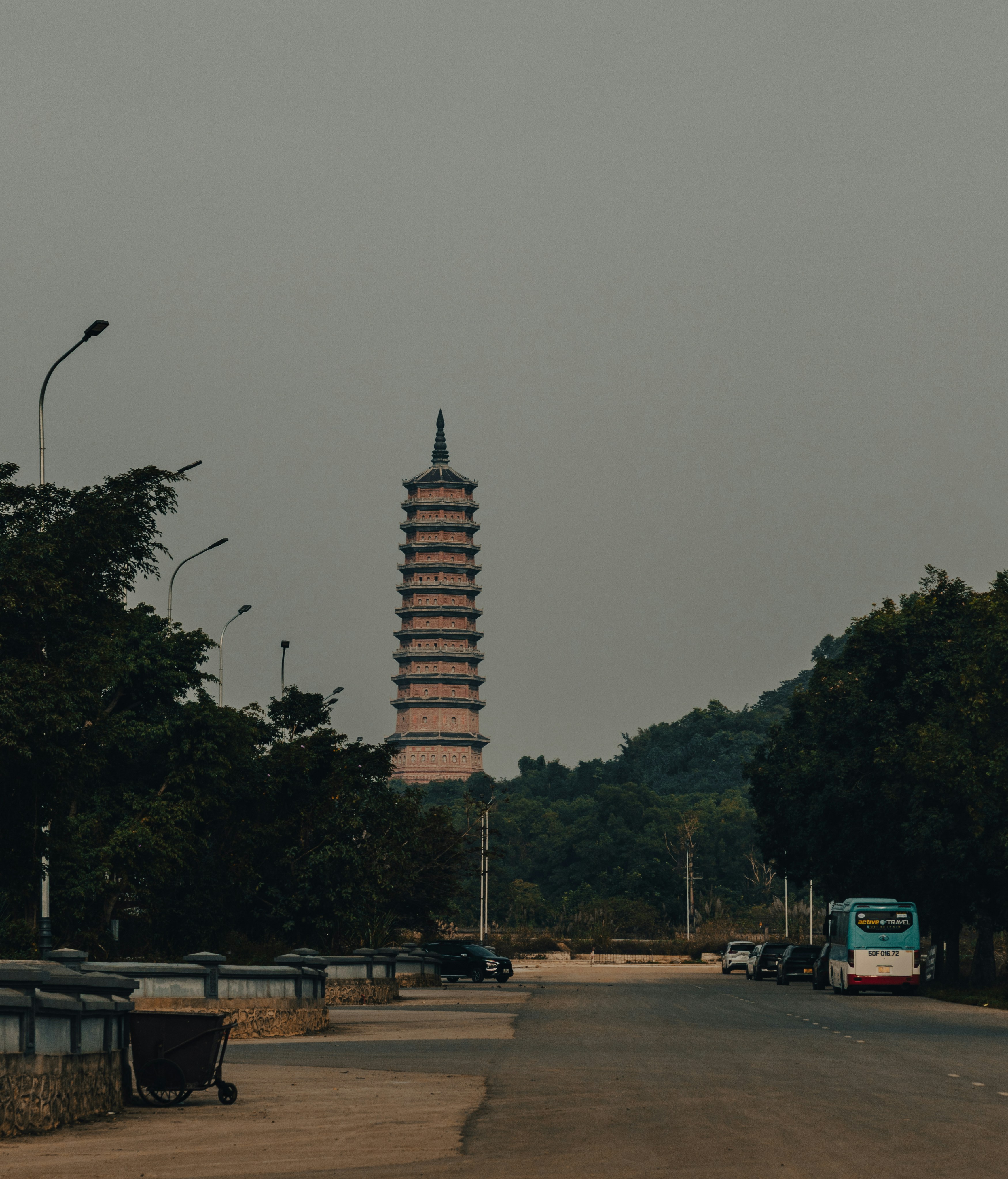 Pagoda Rising Over a Quiet Boulevard at Dusk