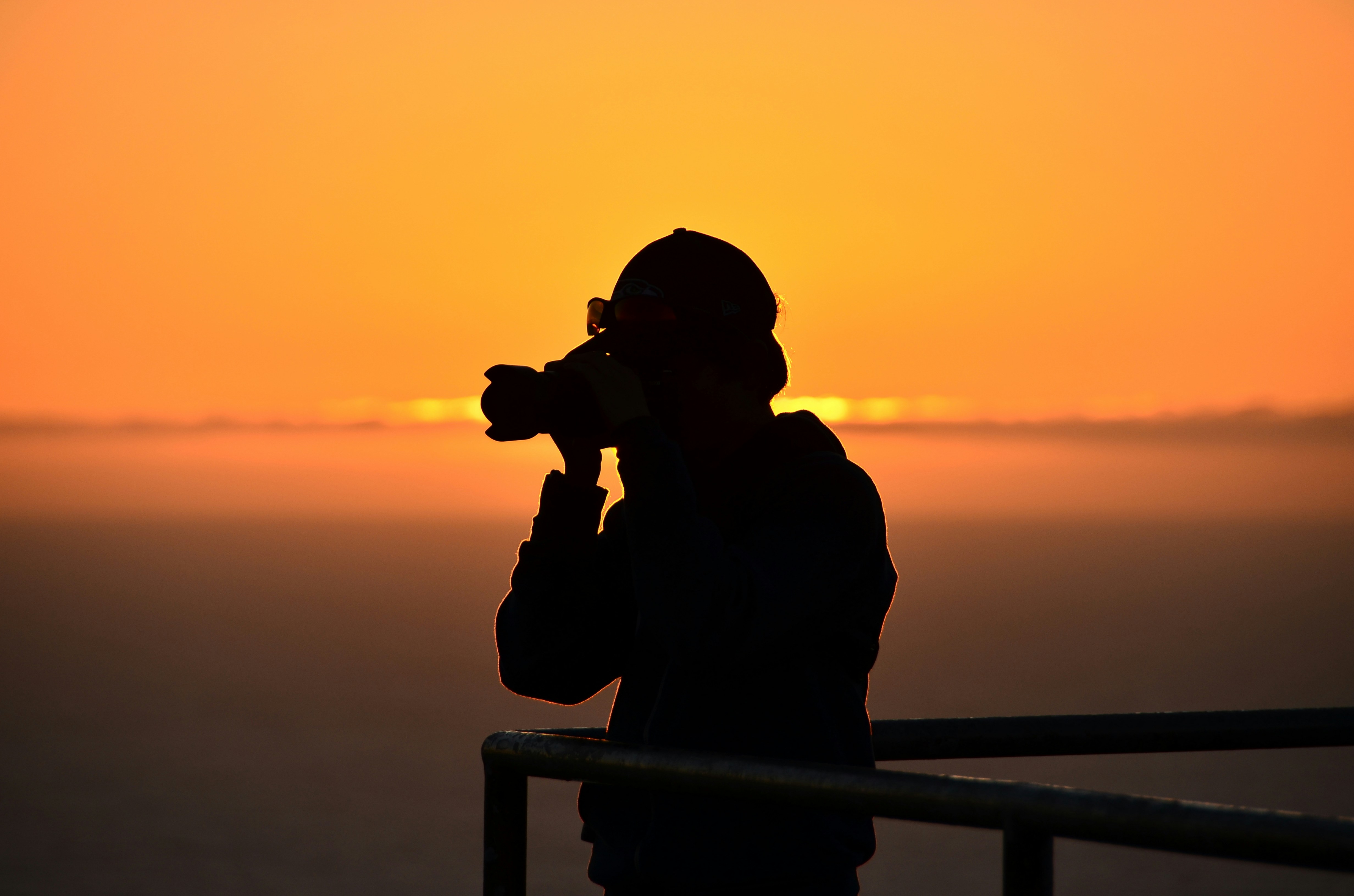Silhouette at Sunset: A Photographer’s Quiet Vigil