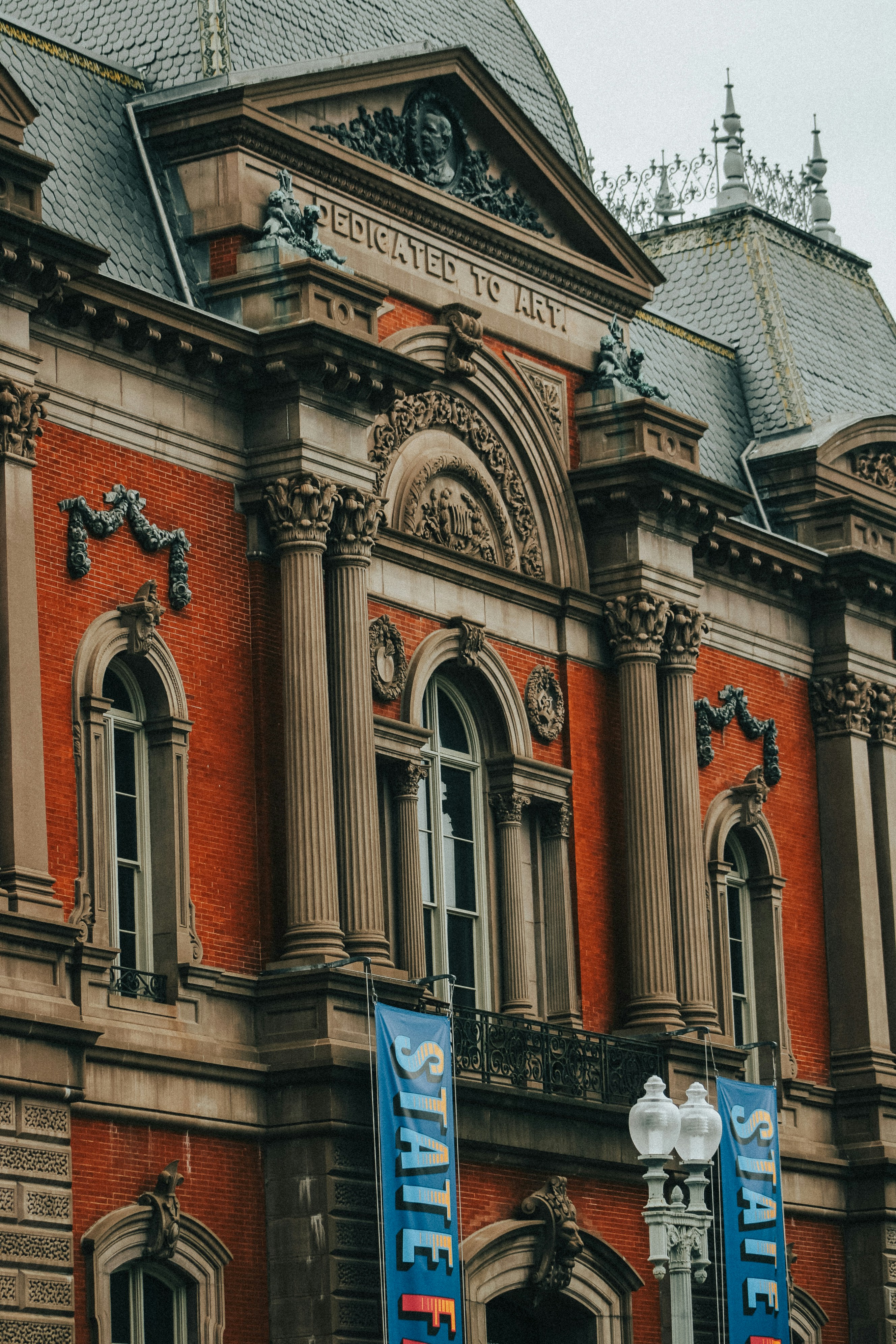 Architect’s Scroll: Historic Facade with Bannered Entry