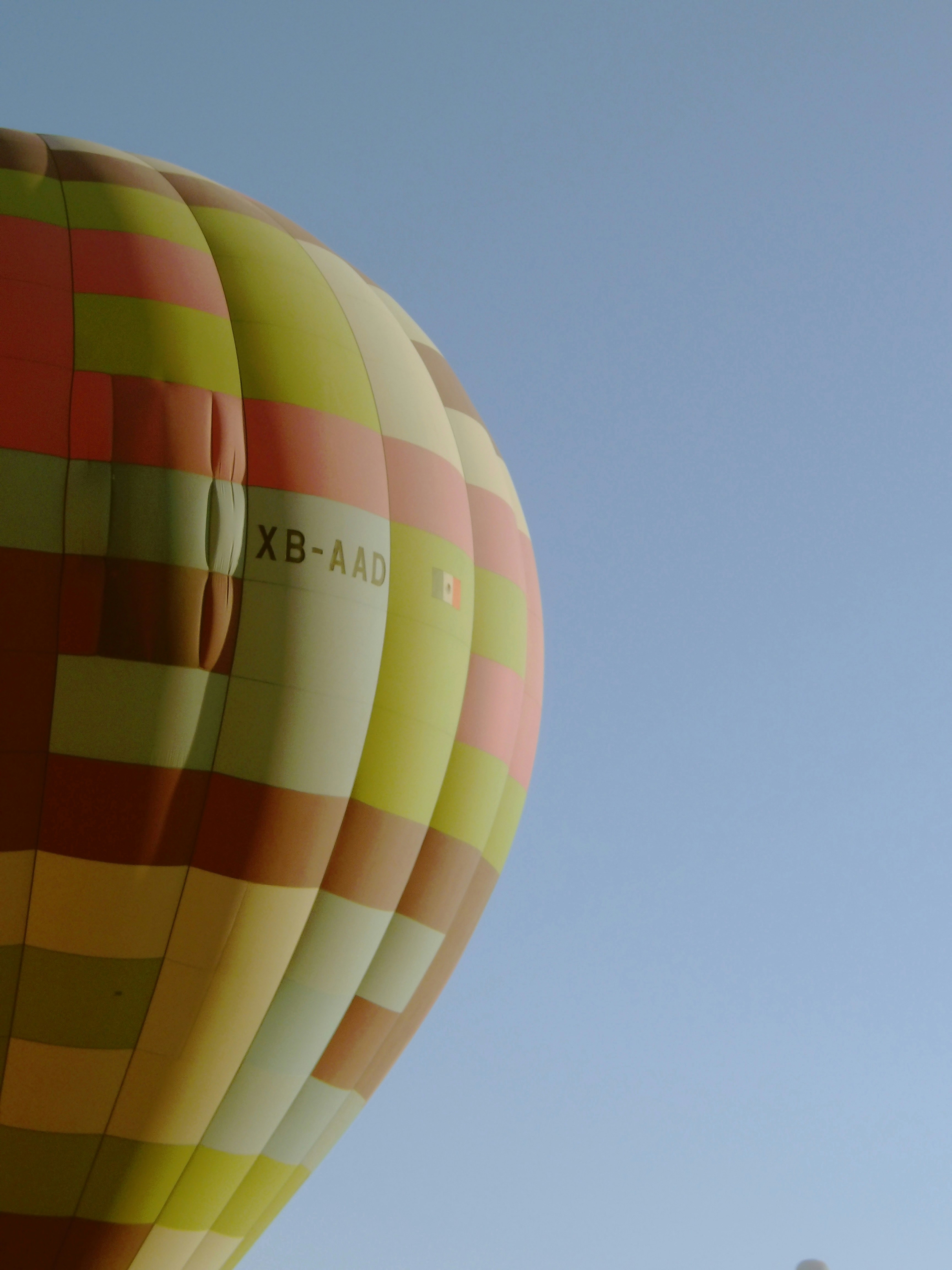 Close-up of a colorful hot air balloon against blue sky