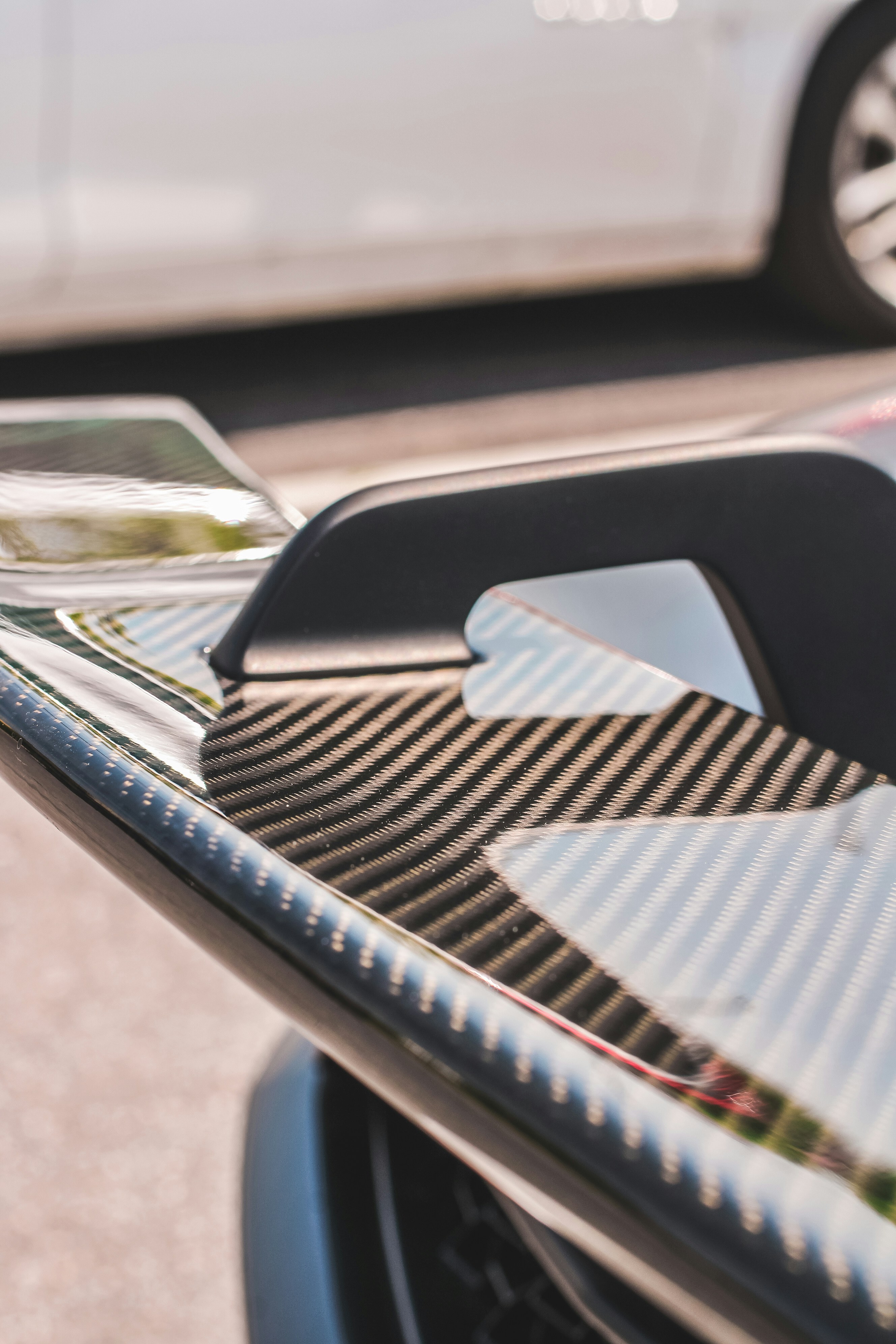 Carbon Weave and Curves: A Car’s Wing in Focus