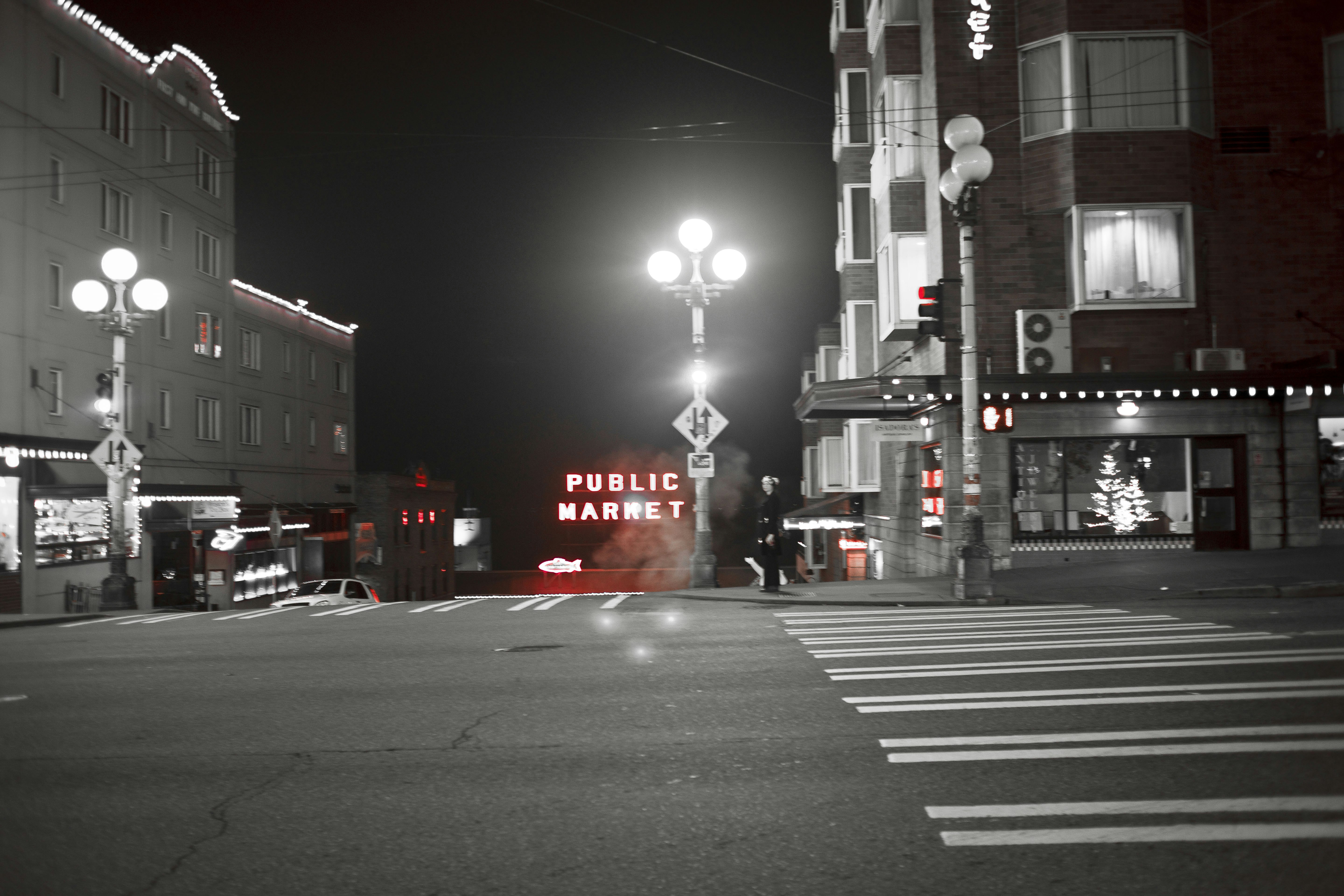 Neon in the Night: Public Market Sign Illuminating a Quiet Street