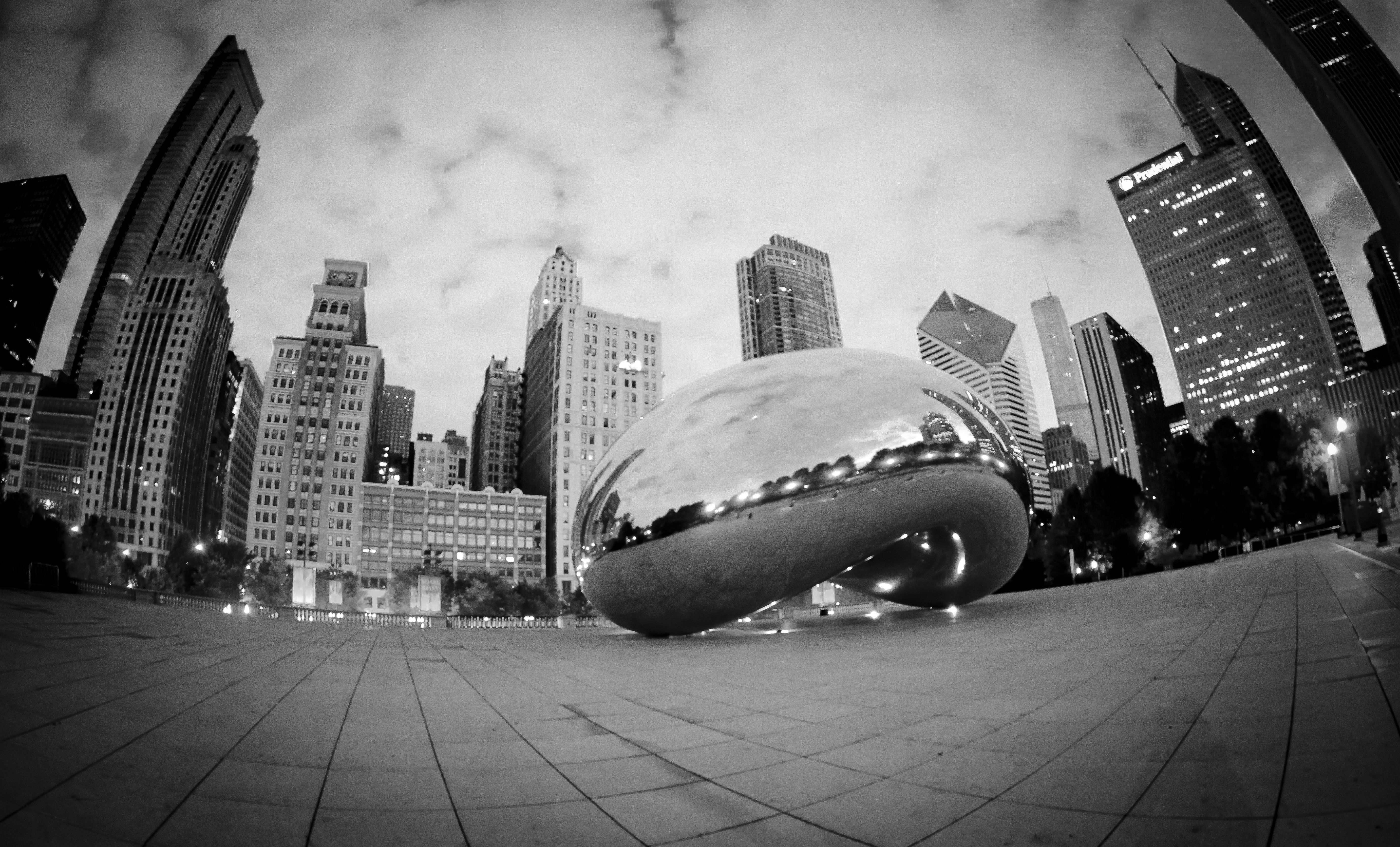 Reflected City: Cloudy Skies and the Bean in a Monochrome Sweep