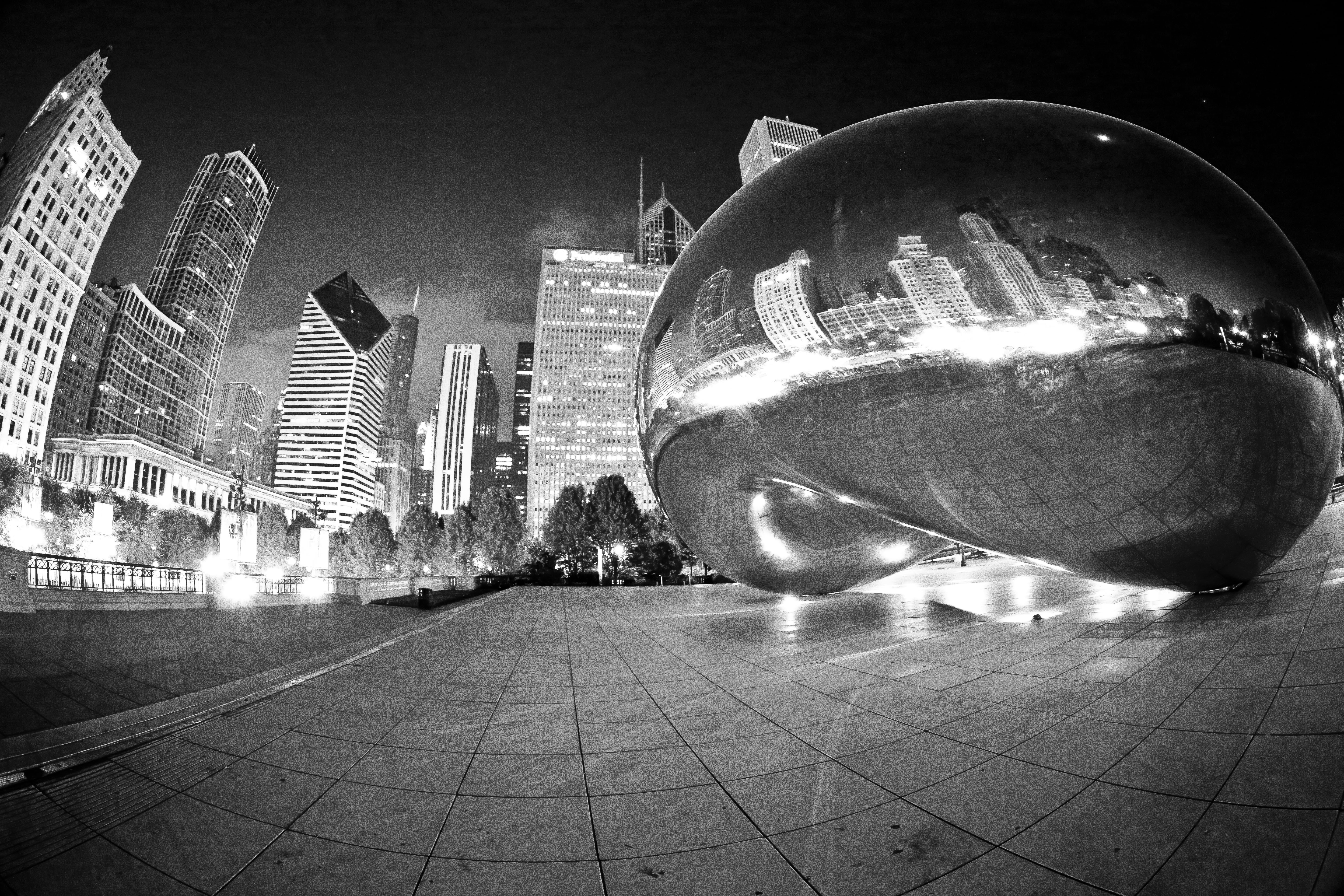 Gleaming Sphere over Chicago's Riverwalk at Night