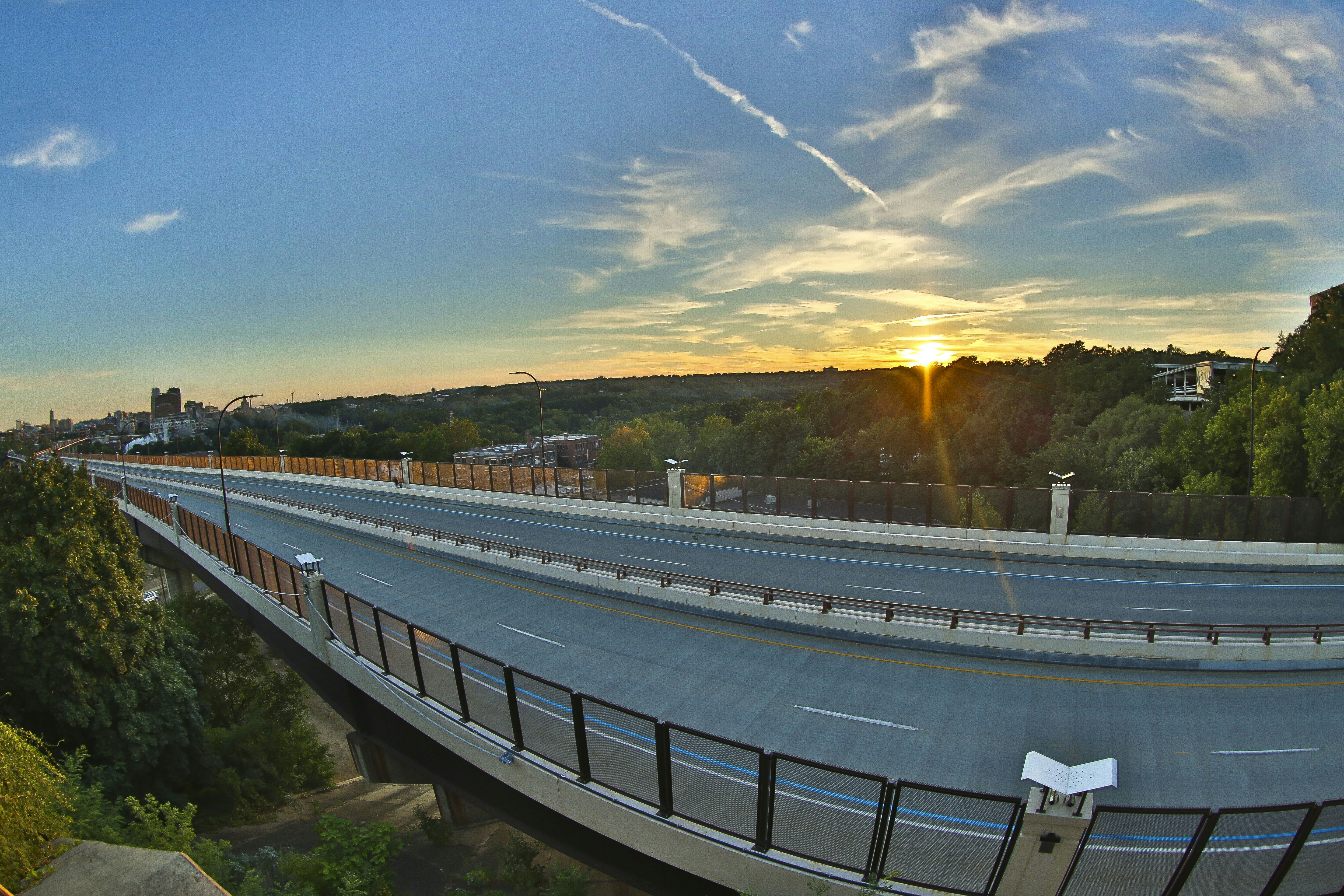 Sunlit Axis: A Quiet Drive Over the City Canal