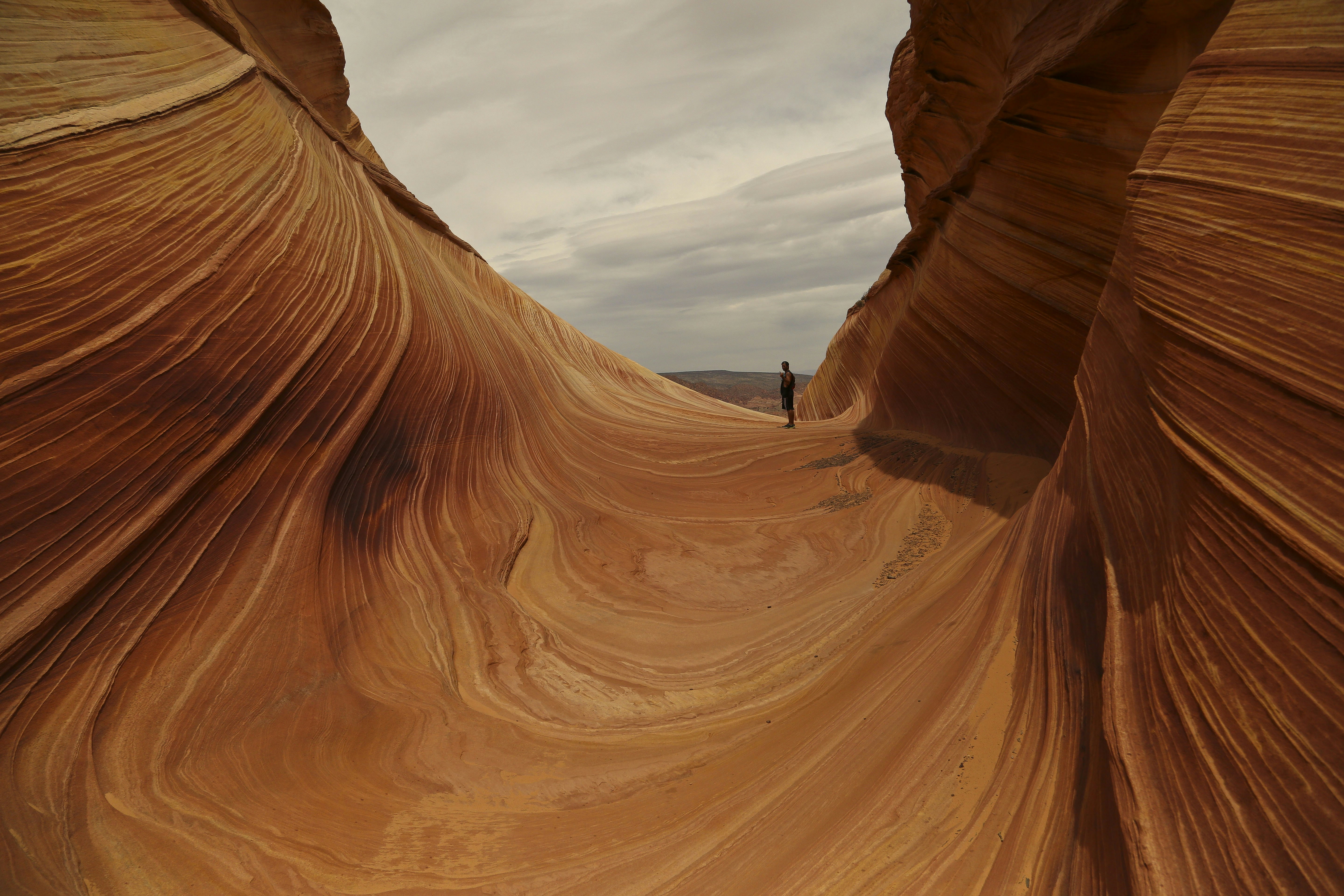 Winding Canyon Echoes: A lone explorer in the sculpted sandstone
