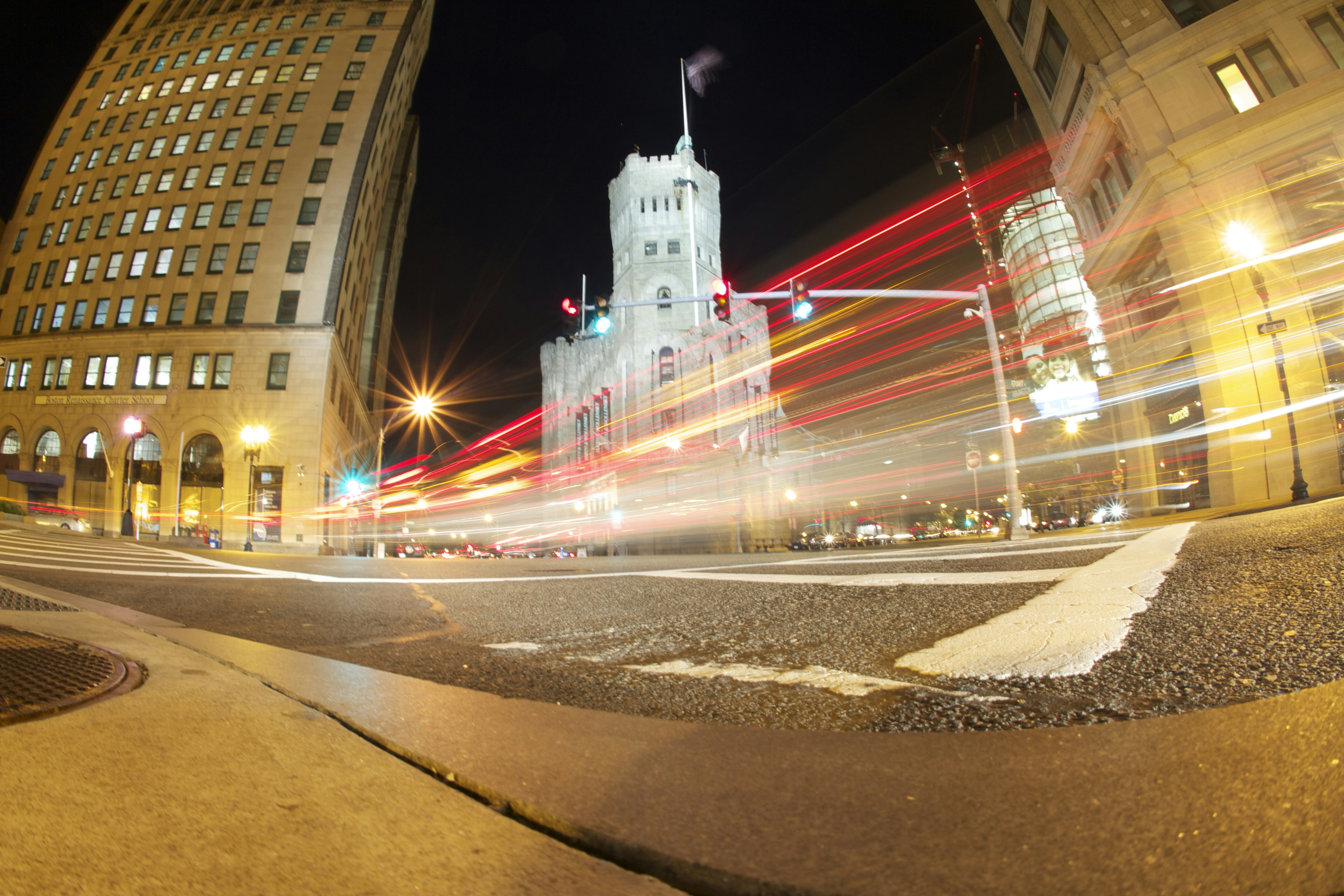 Midnight Street Rush: Light Trails Across a City Intersection