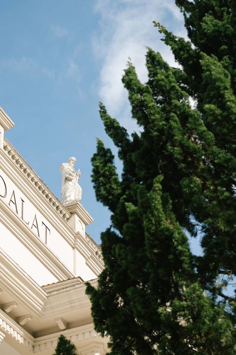 Statue Corner: Classical Details Meet Towering Cedar