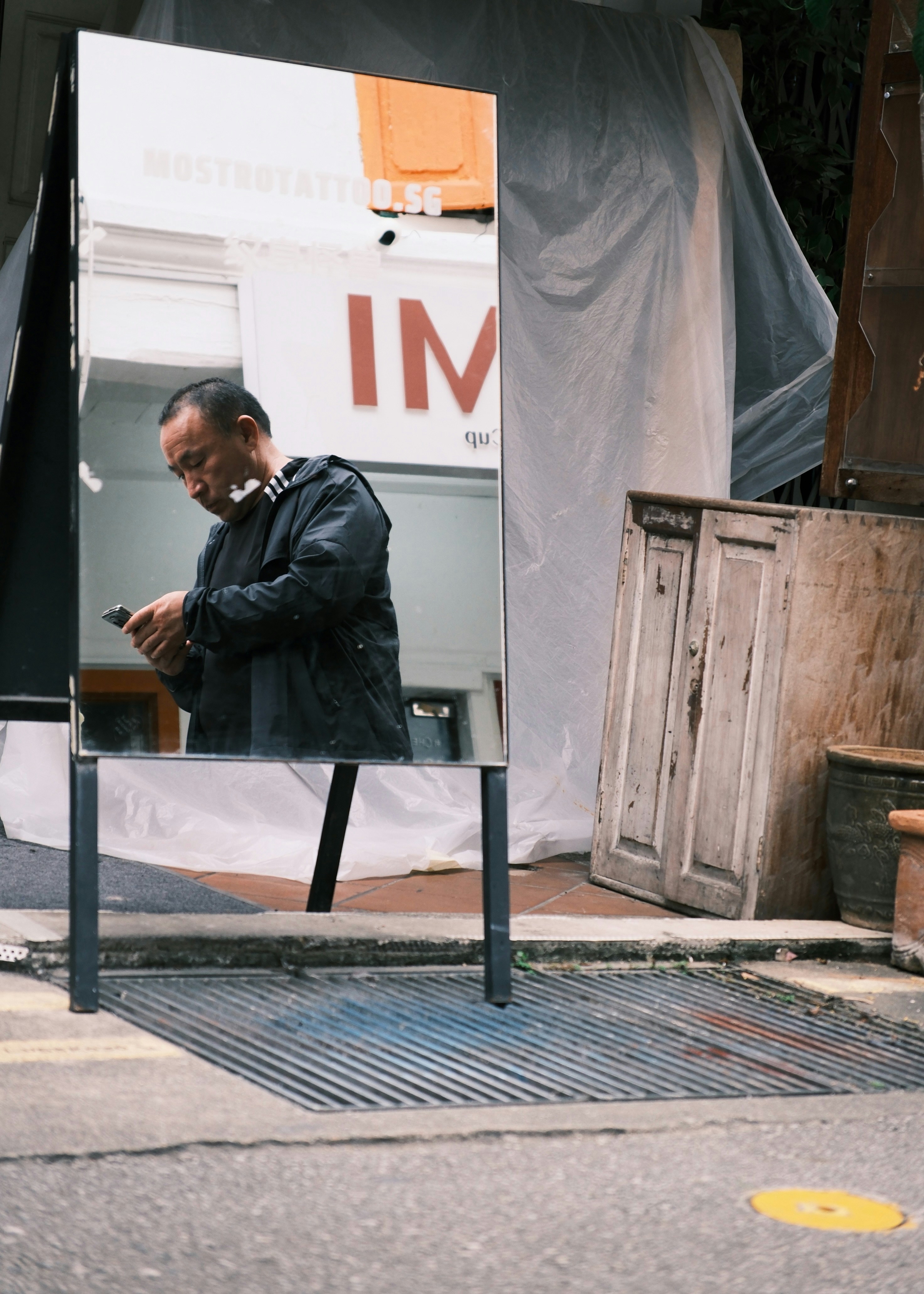 Reflected Moment: A Street Portrait in the Mirror