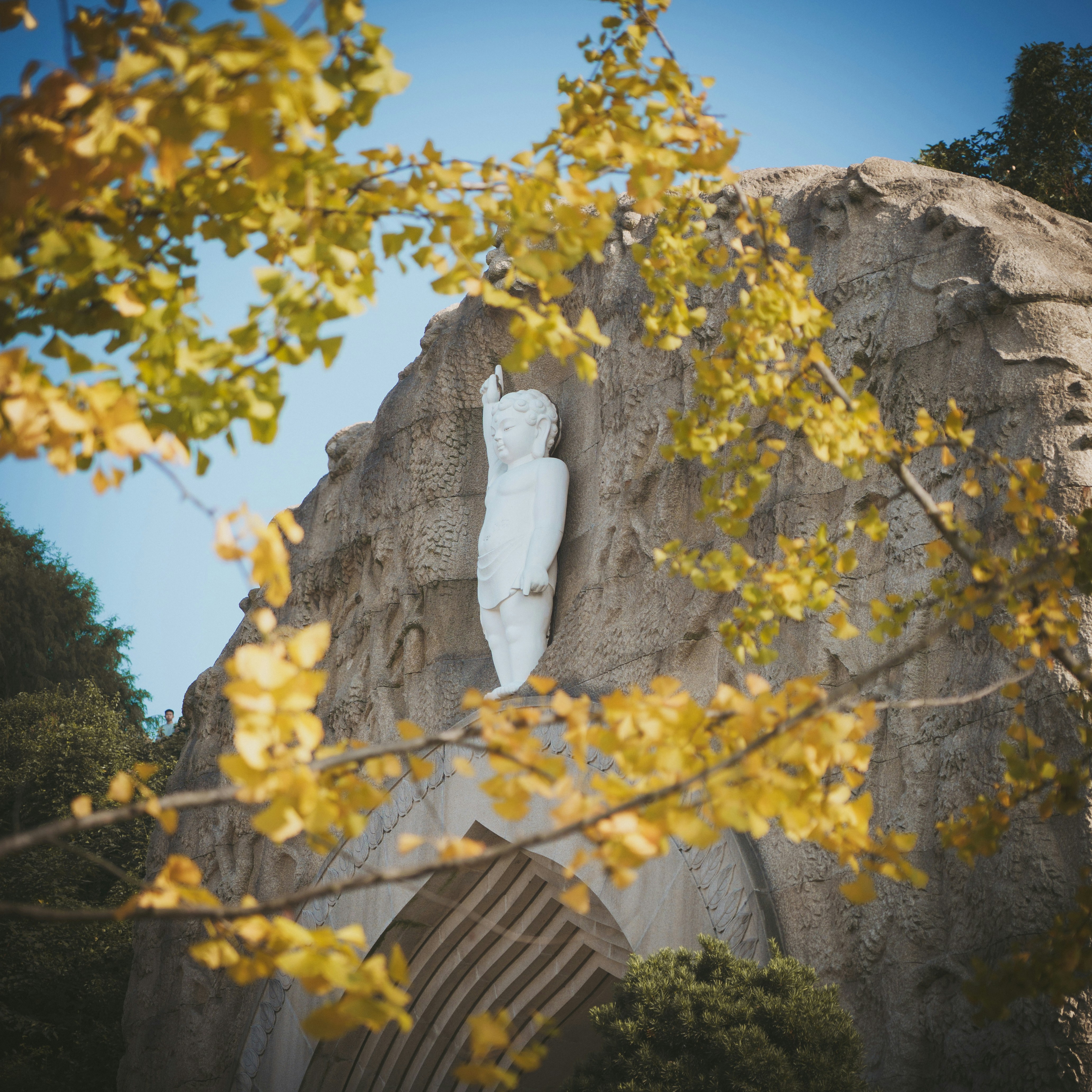 Stone Guardian Amid Golden Foliage