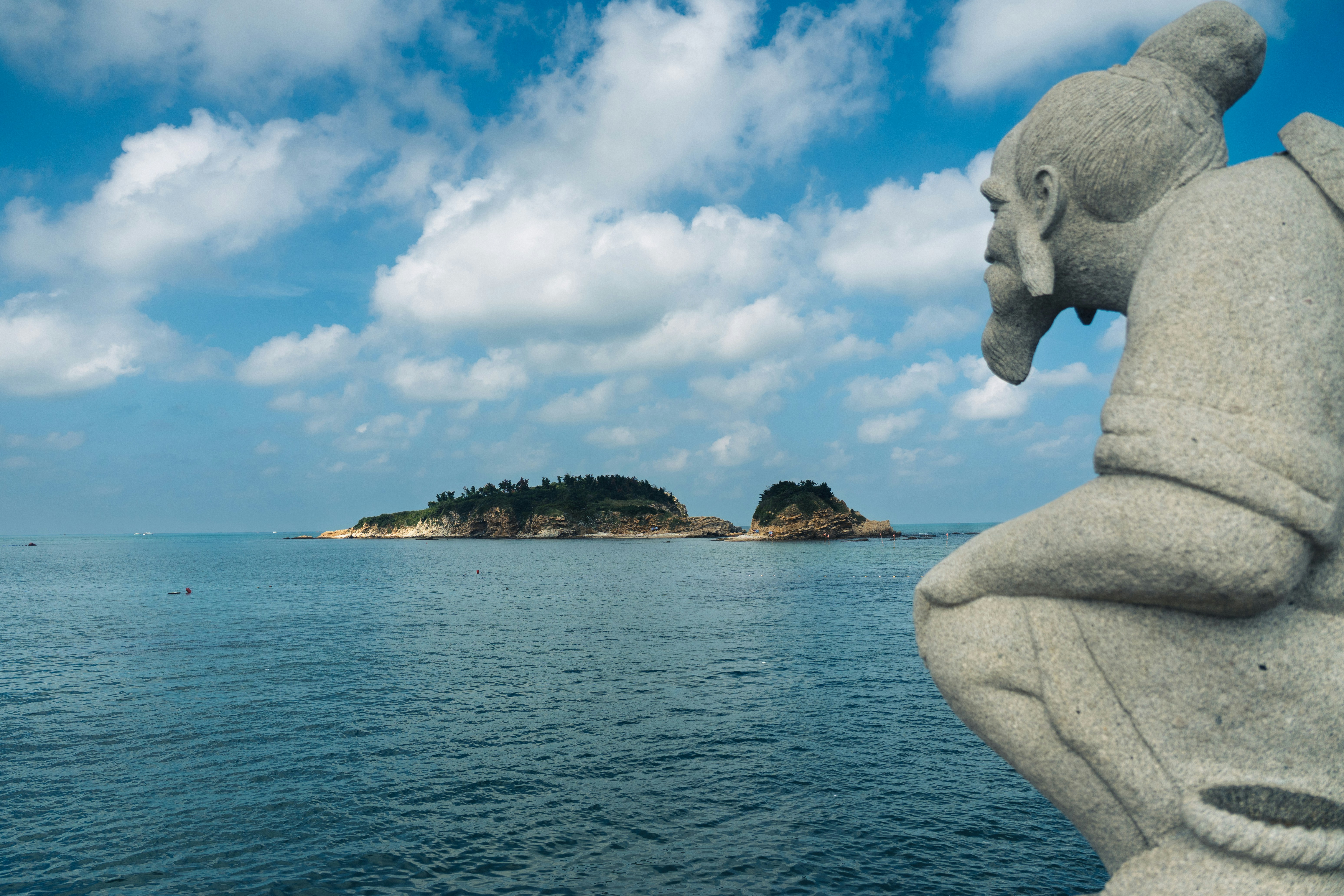 Quiet Watcher by the Sea: A Granite Sentinel Overlooking the Horizon