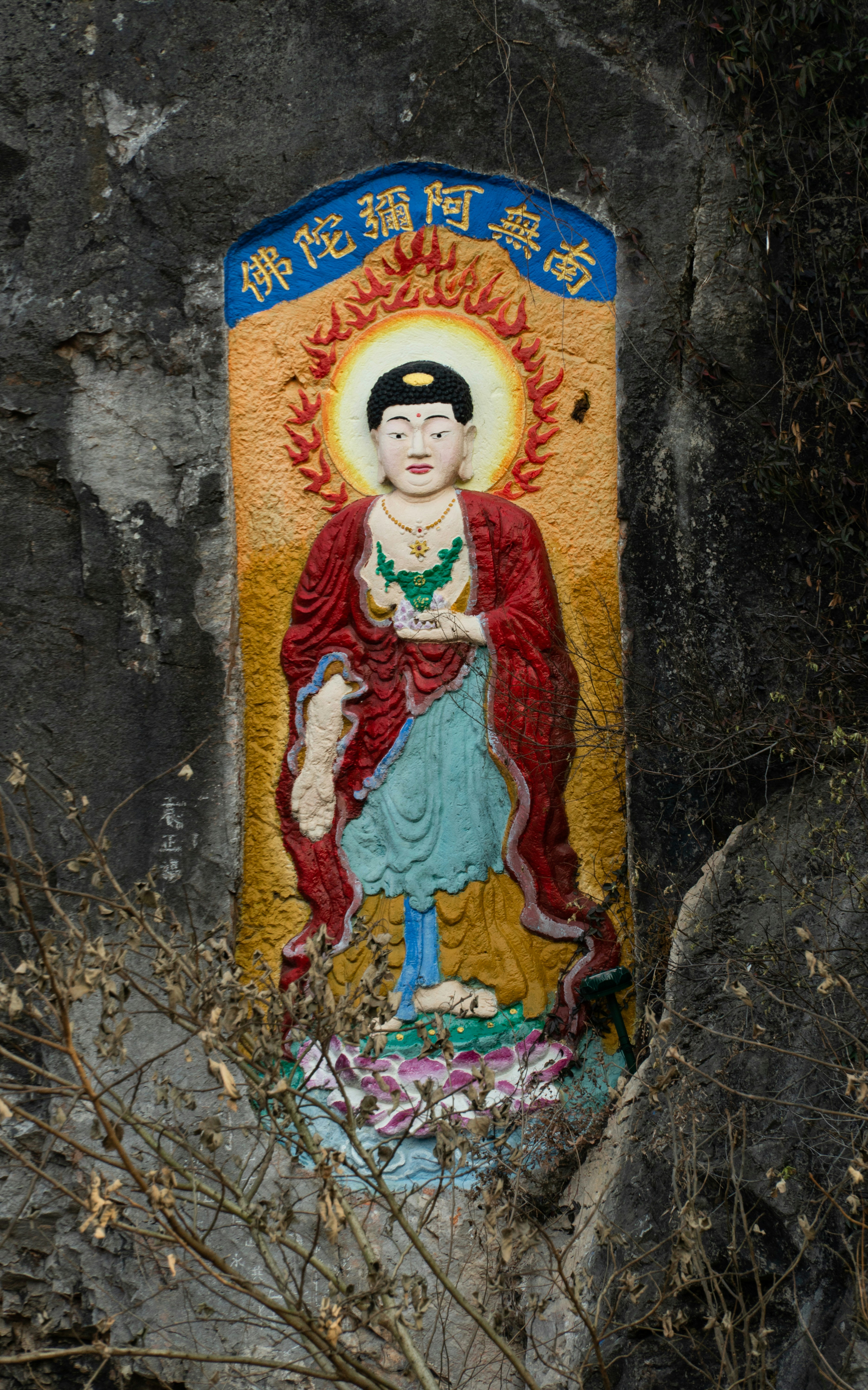 Blessed Figure in a Marble Niche: A Sacred Relief Receding into Cliffside