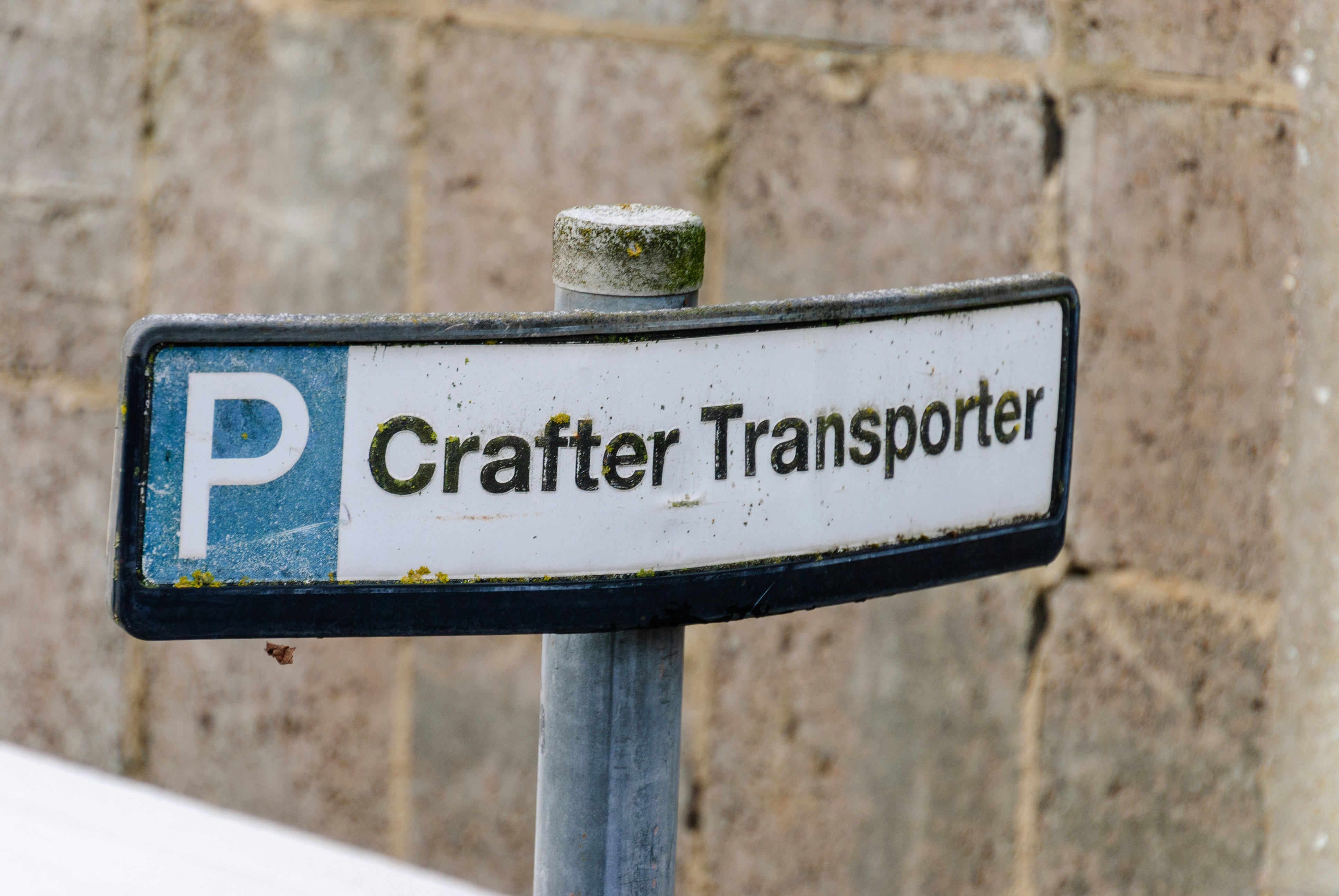 Parking Sign for Crafter Transporter in Weathered Urban Setting