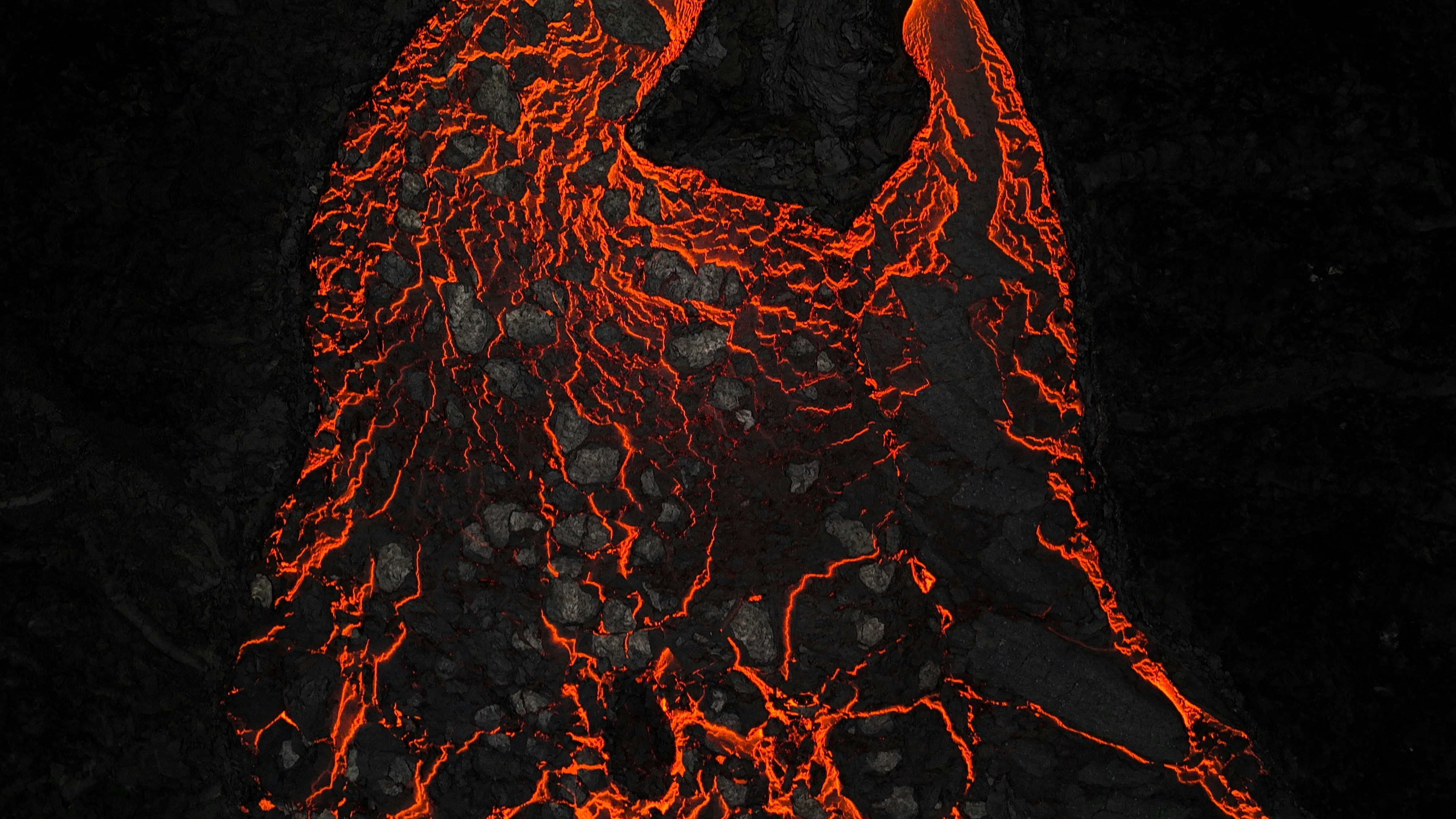 Luminous lava veins on a dark basalt canvas