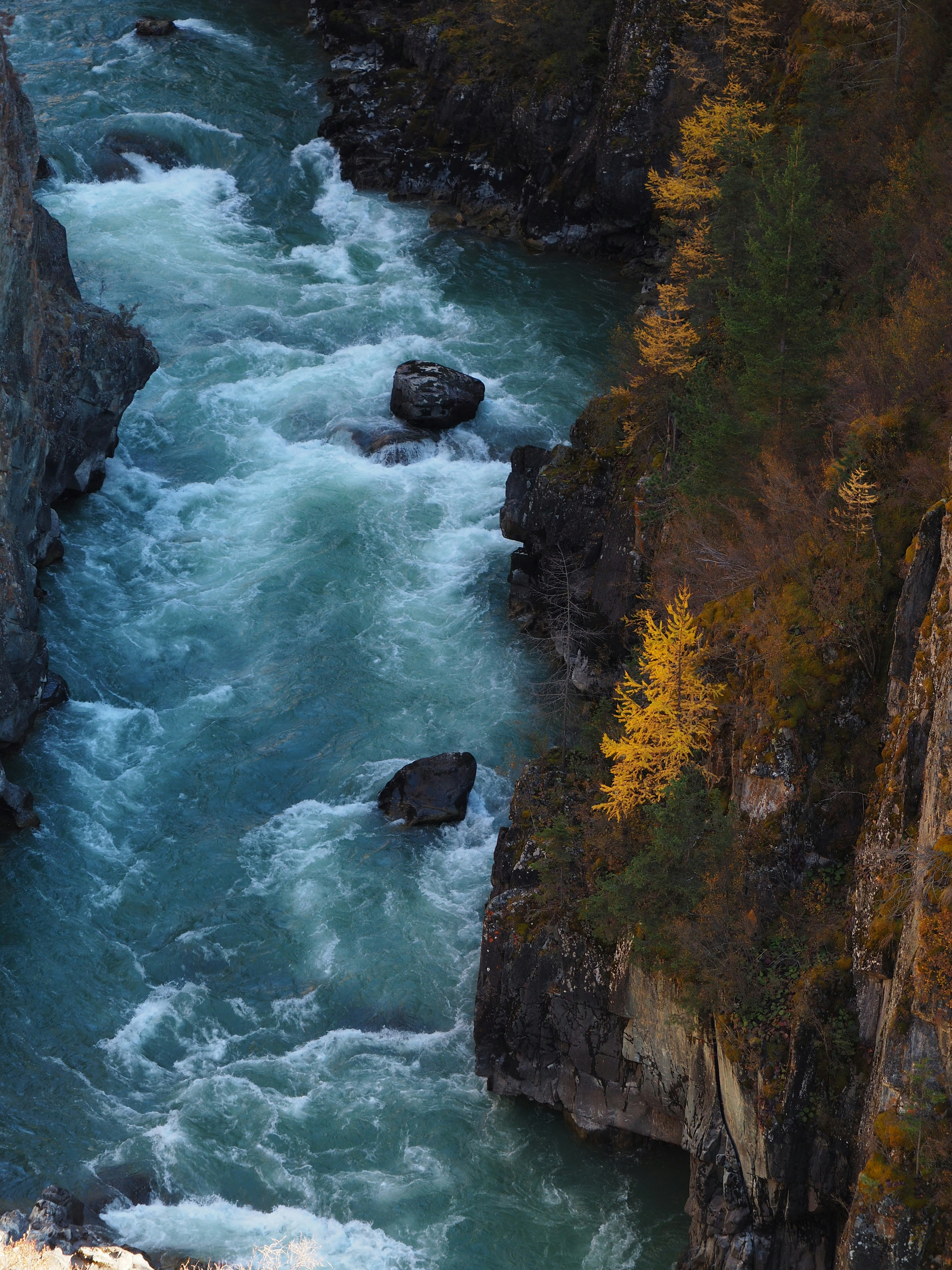 Azure Torrent Between Weathered Cliffs