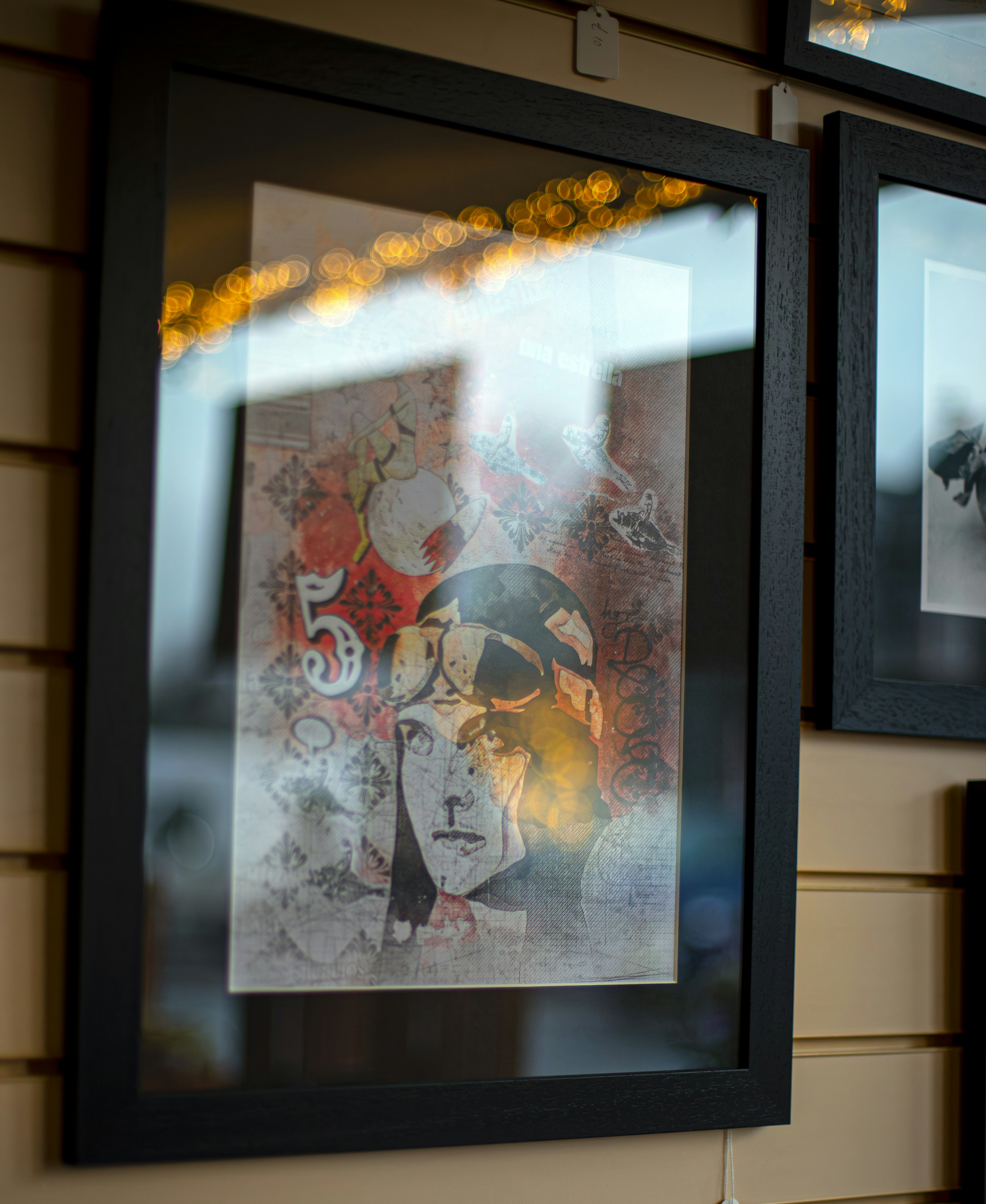 Frame Within a Frame: Framed Artwork Mirrored by Warm Lights