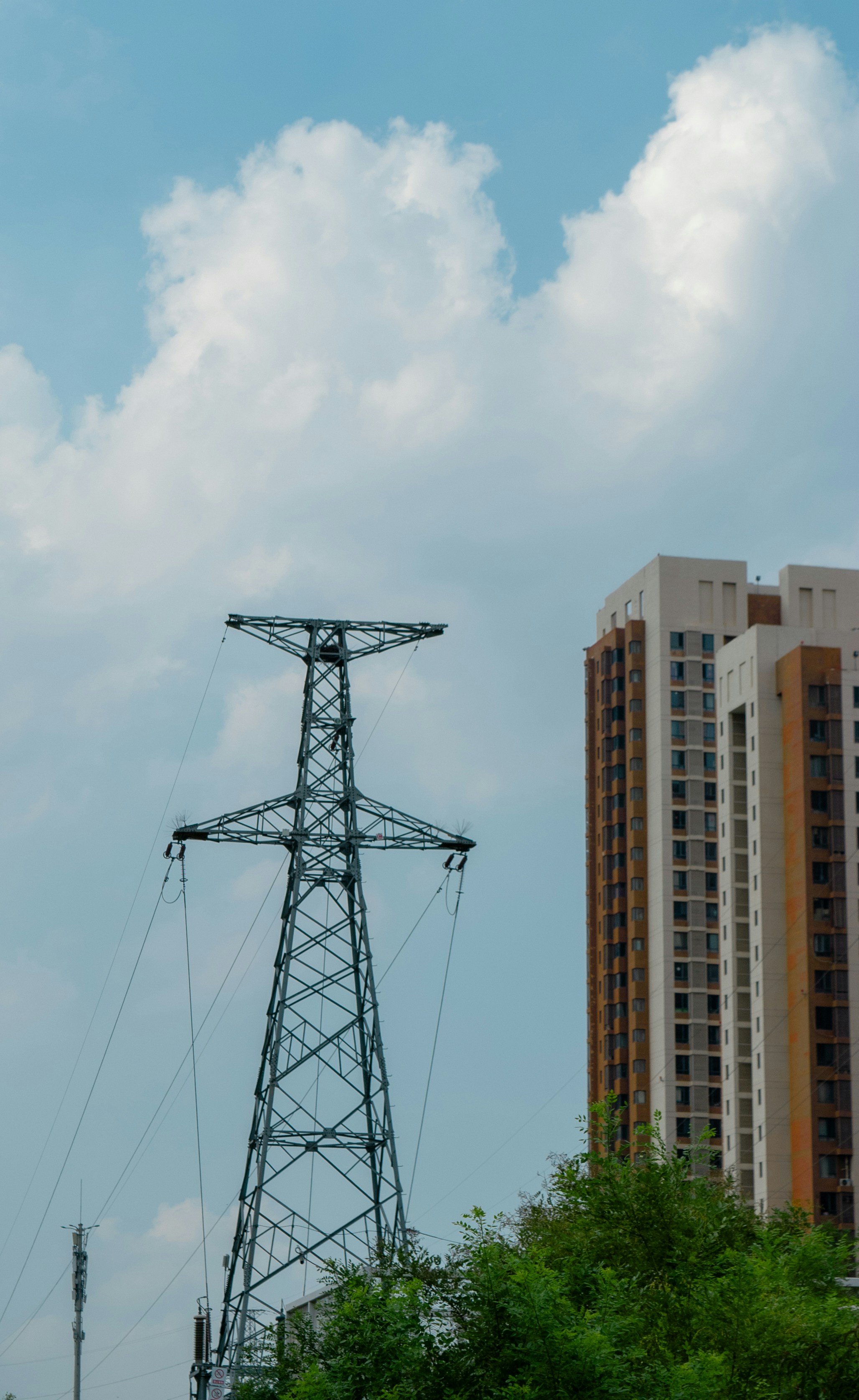 Skyward Lattice: Power Tower with Urban Silhouette