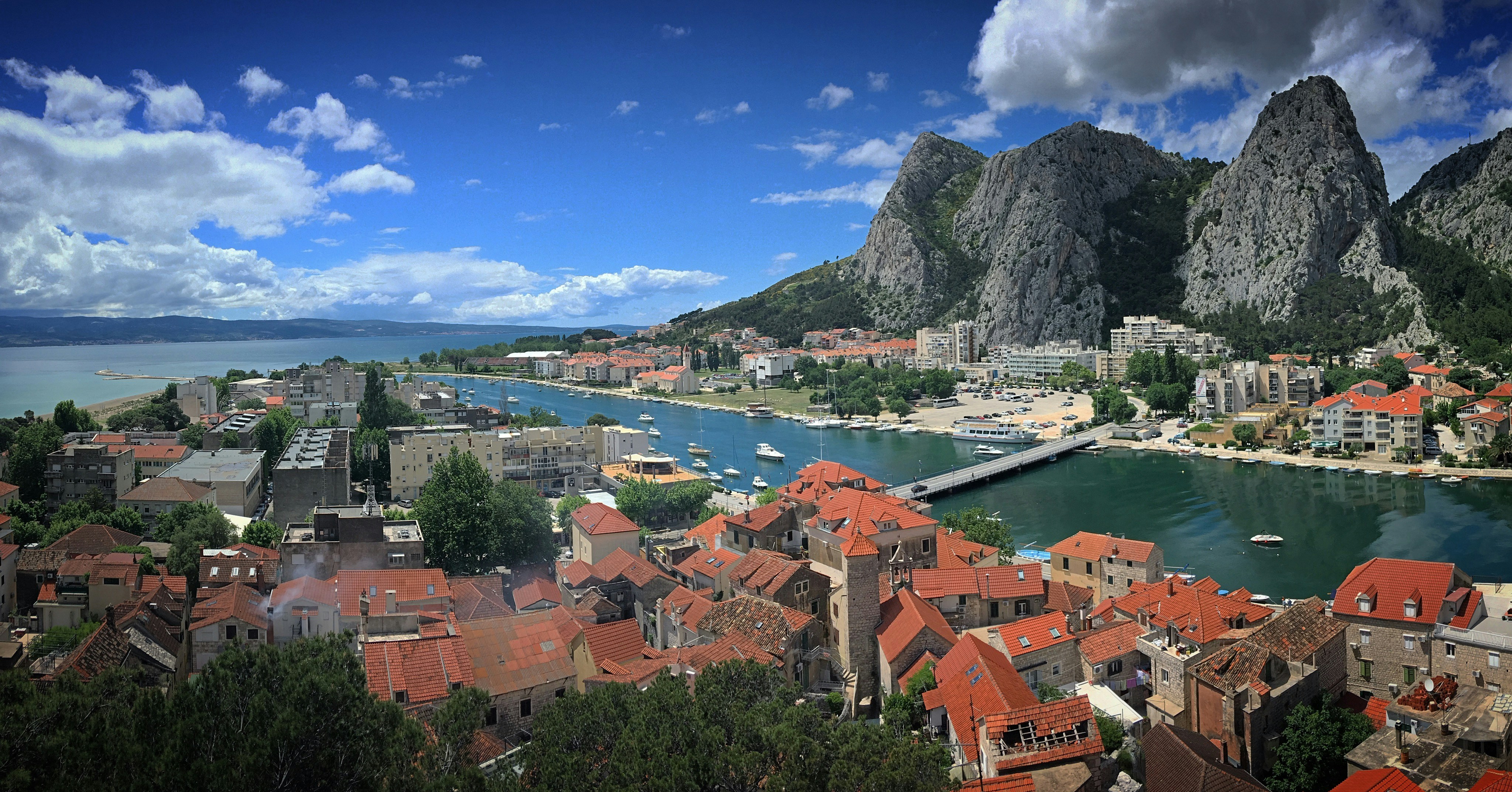 Harbor Village at the Foot of Towering Limestone Peaks