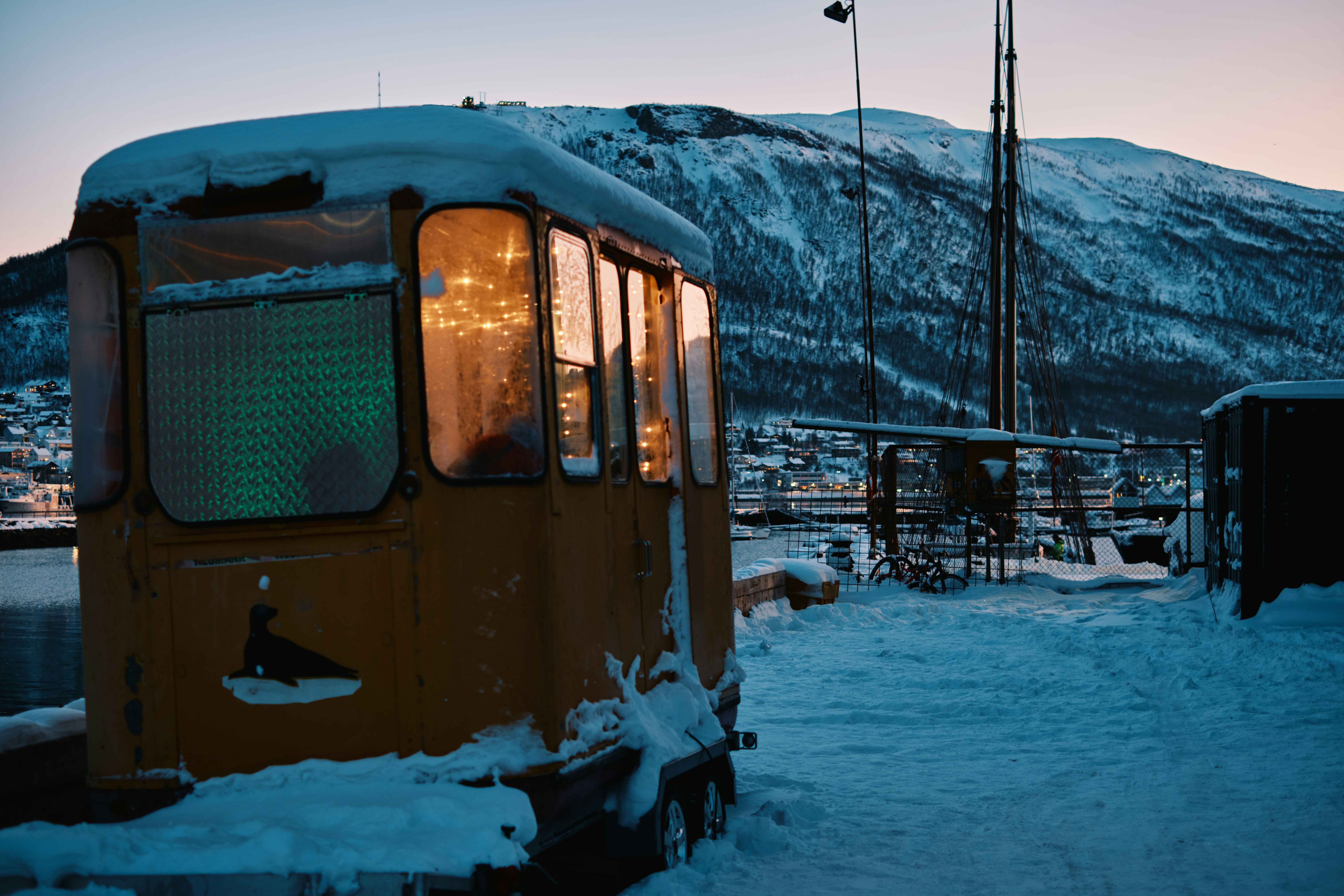Snowbound Work Train: Warm Lights in a Frigid Harborside