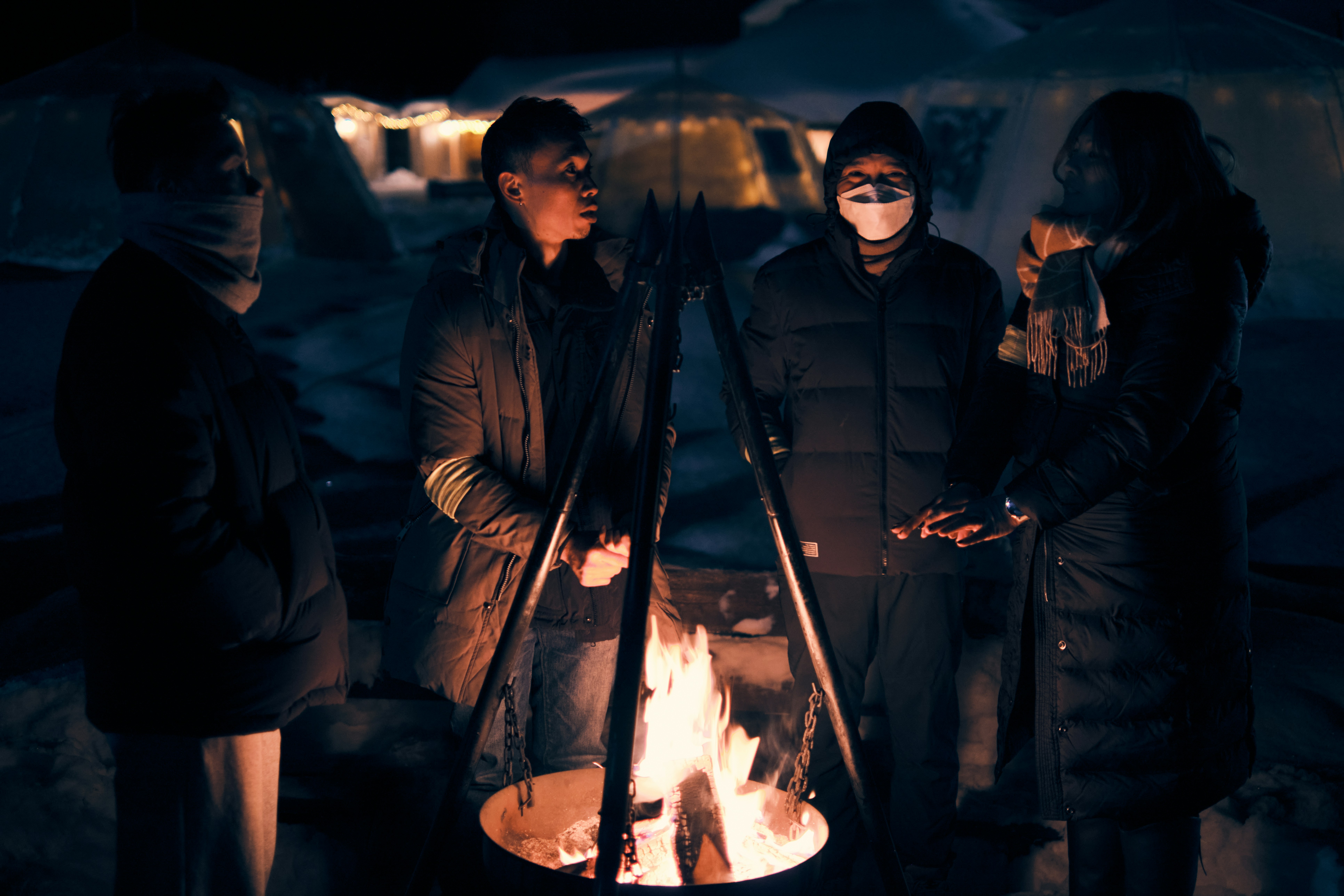 Midnight Campfire Assembly: Faces Steady Around the Flame
