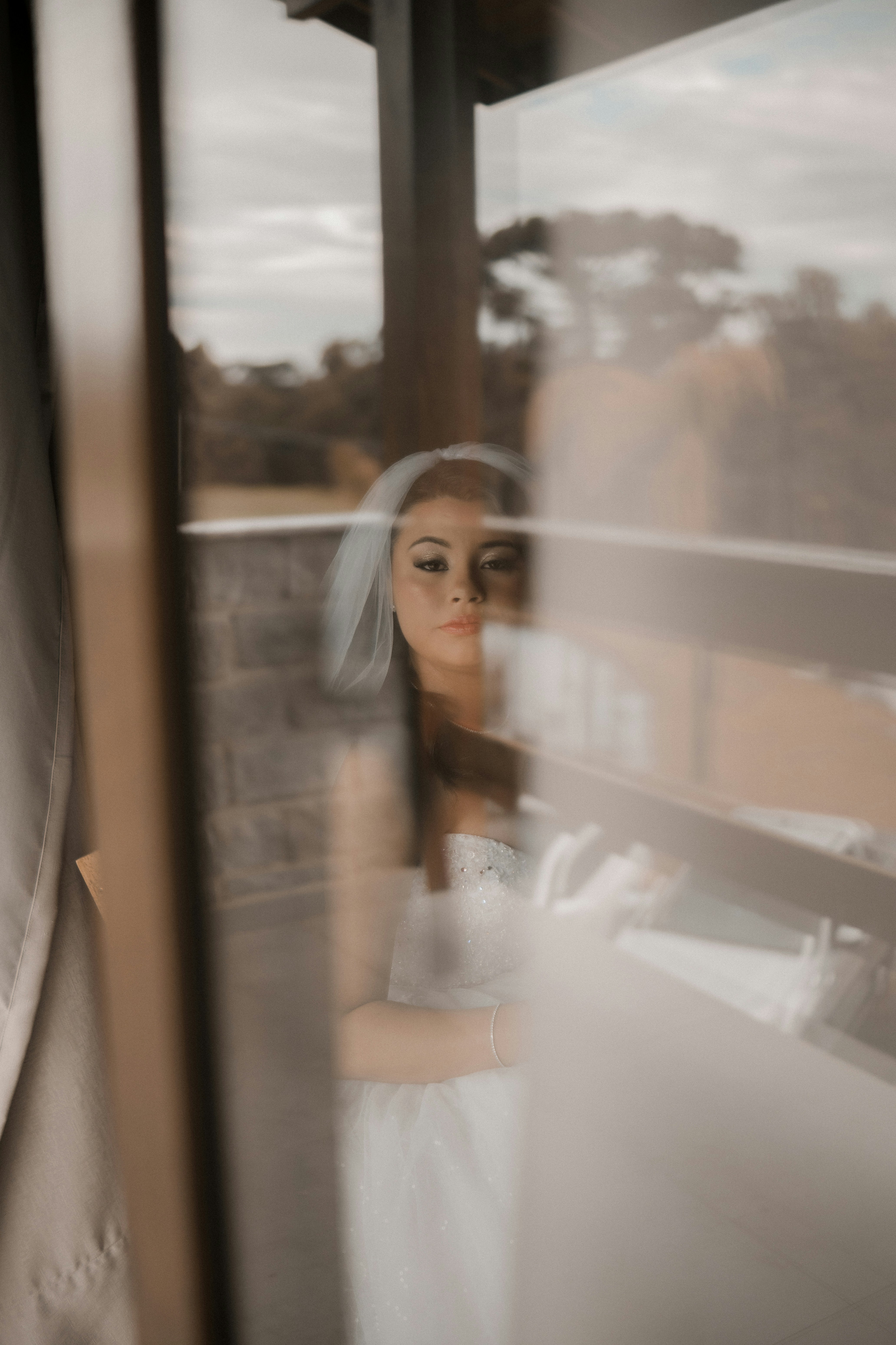 Veiled Bride in the Window: Subtle Reflections