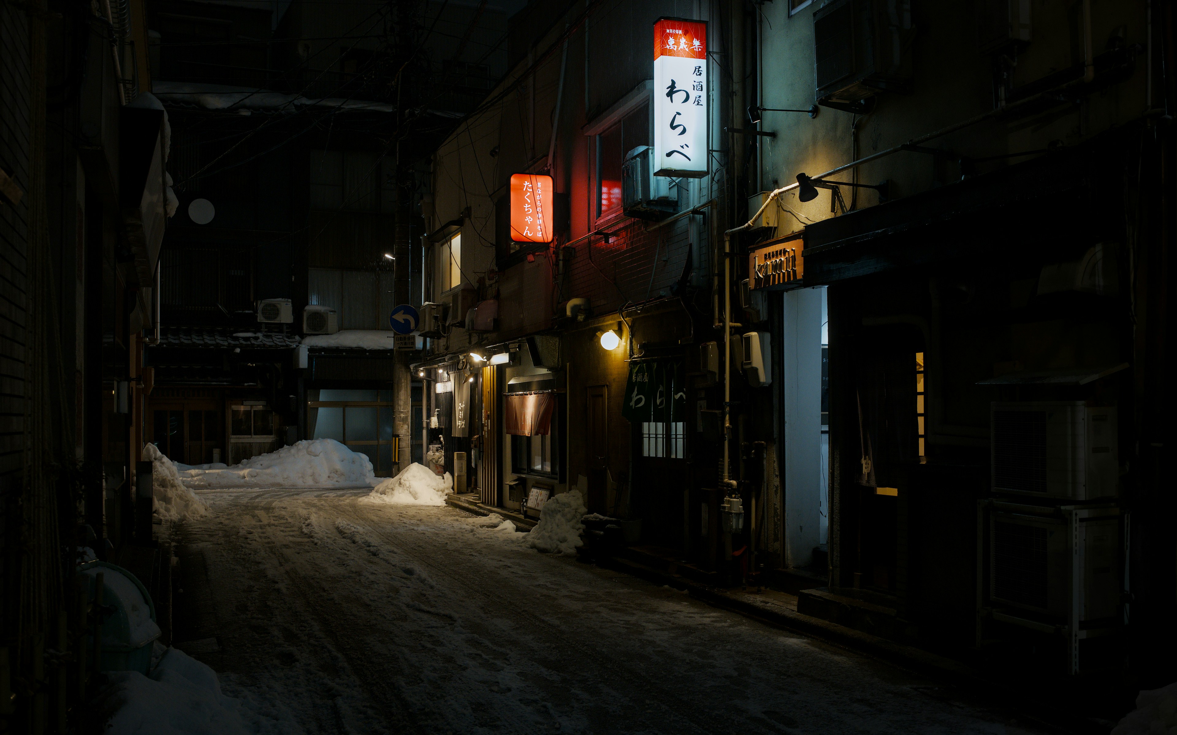 Night Kitchen Lane: Neon Signs Amid Snow