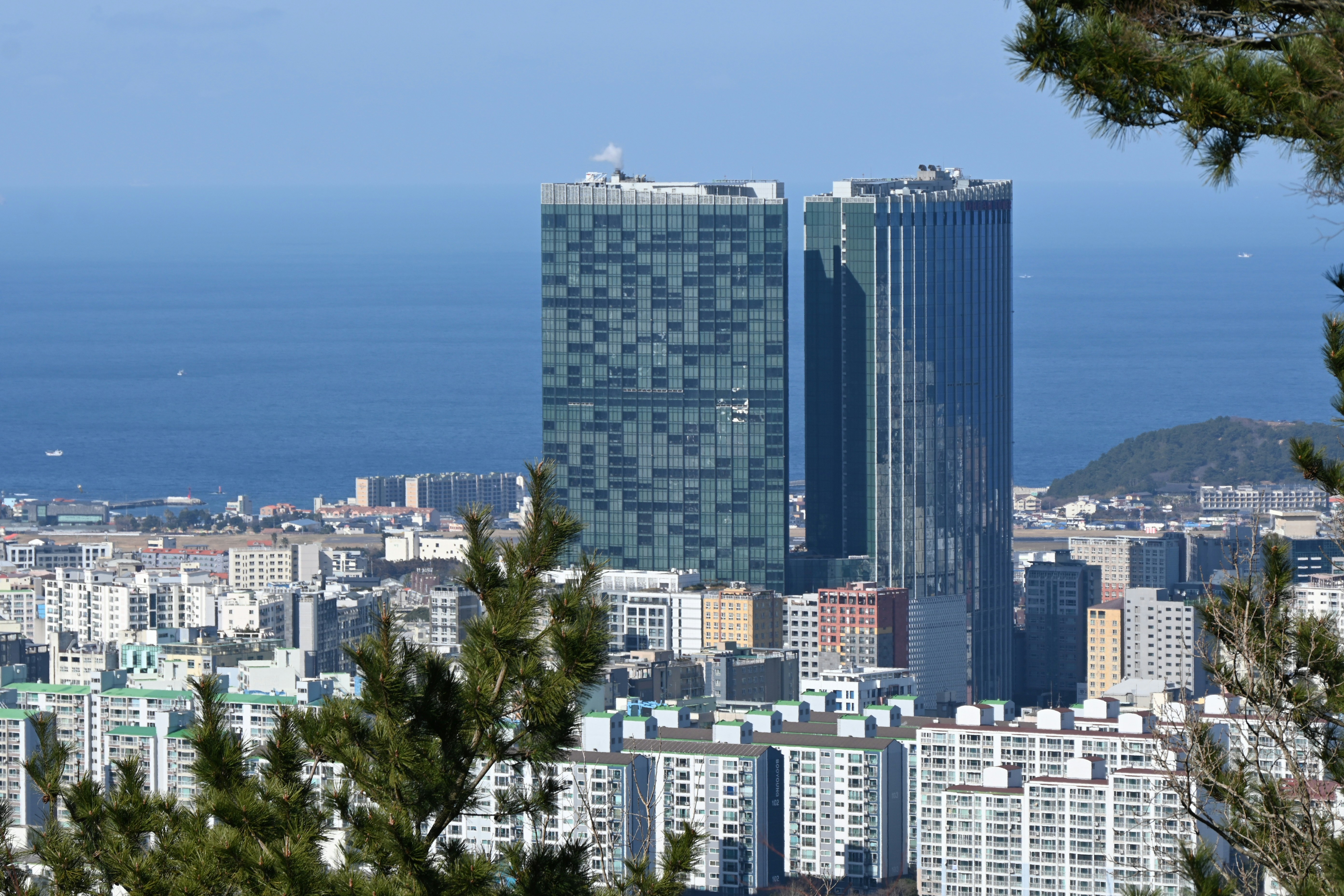 Twin-tower Mavericks: A Coastal City Rising Beyond the Pines