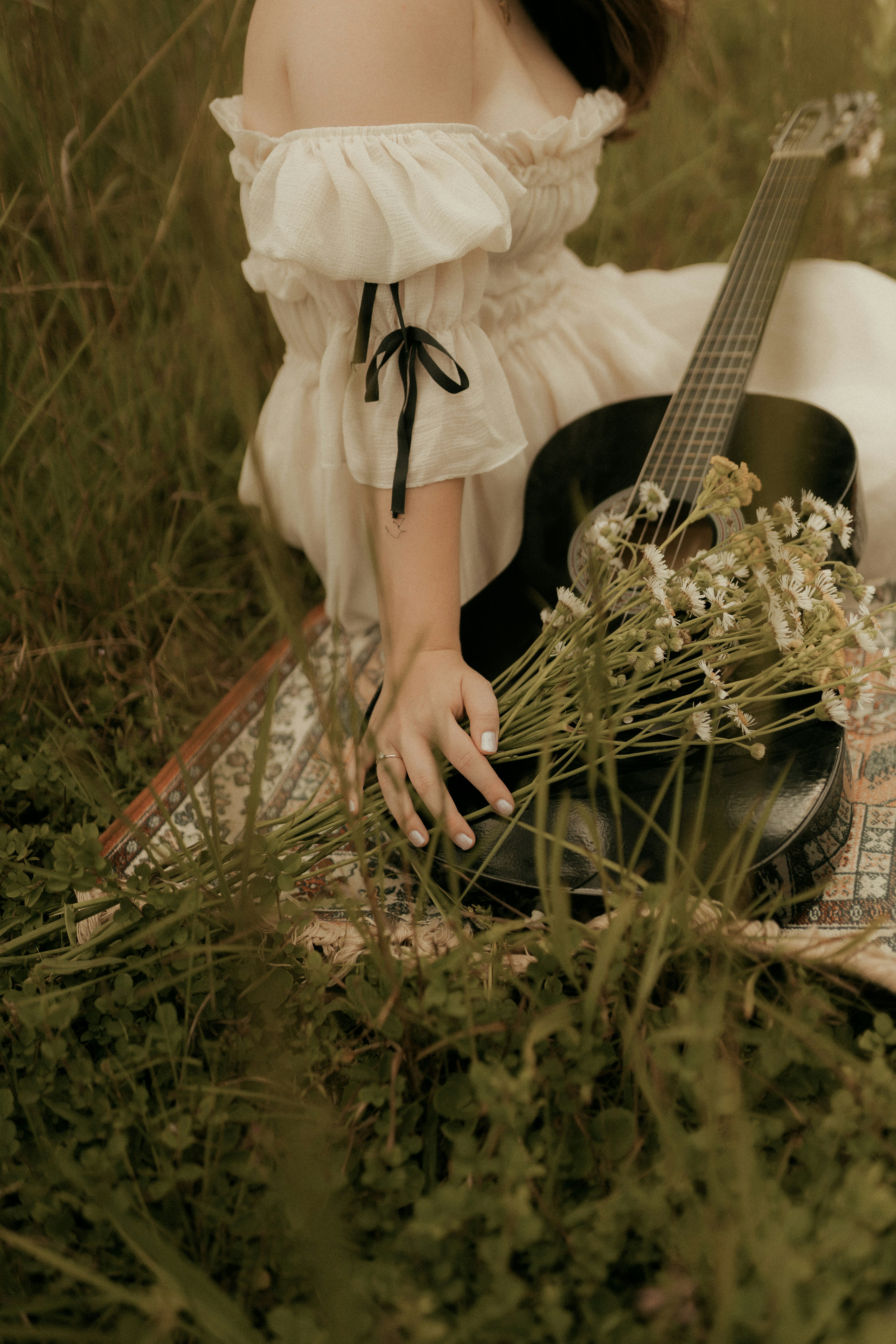 Gentle encore: a sunlit moment with a guitar in wildflowers