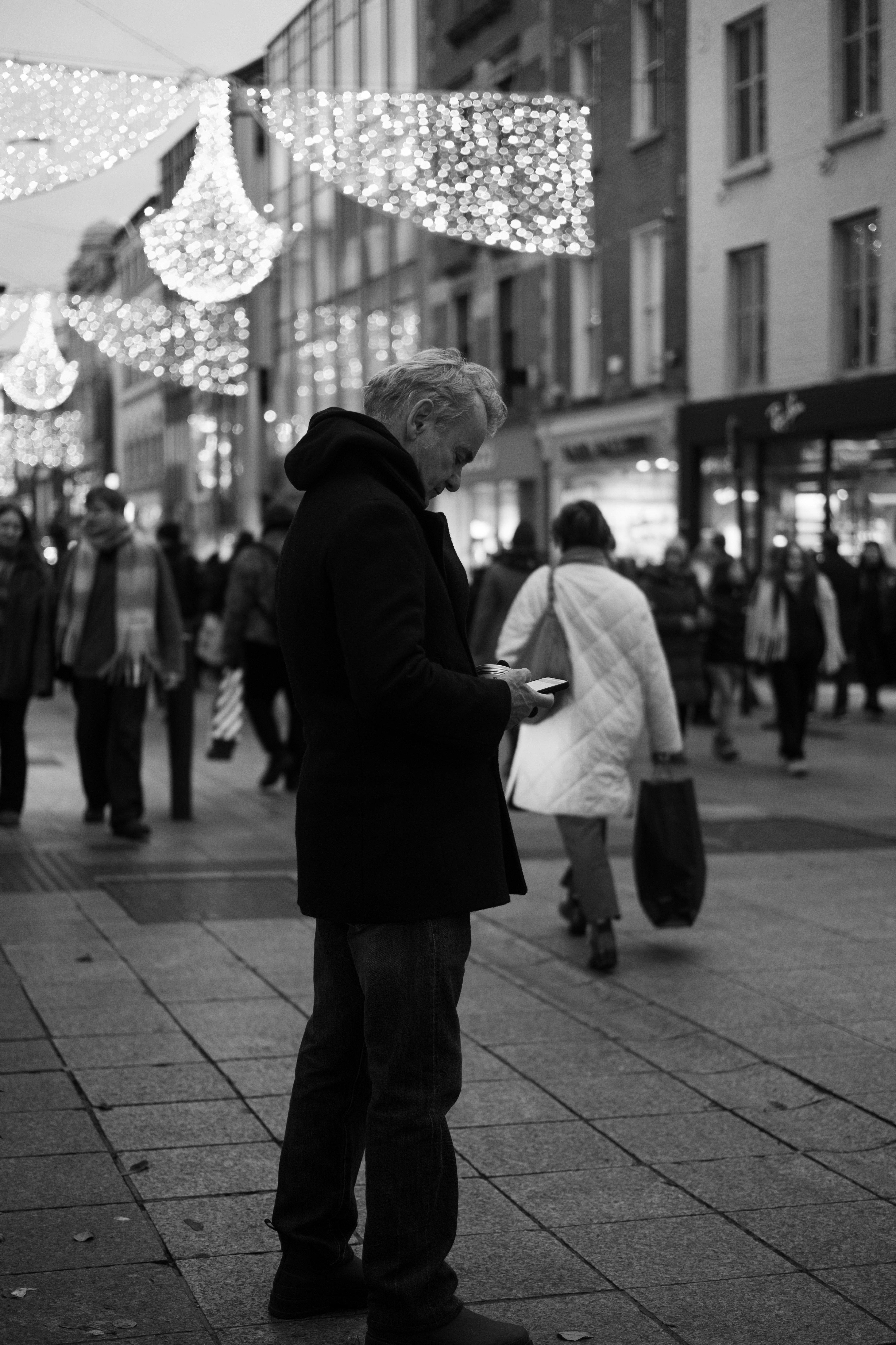 Midtown Pedestrian Portrait Under Festive Street Lights