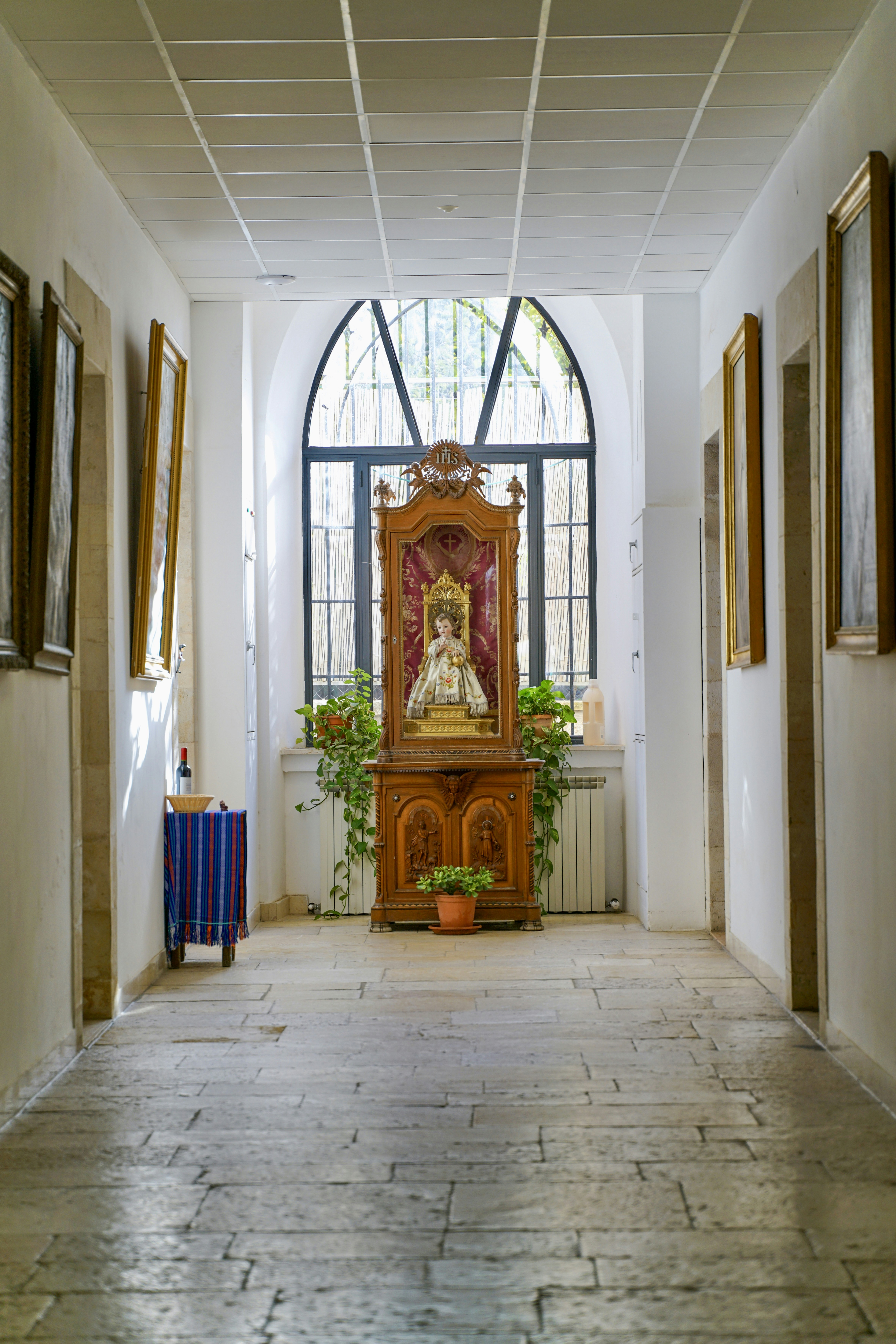 Sanctuary at the End: A Sunlit Altar Framed by a Quiet Corridor