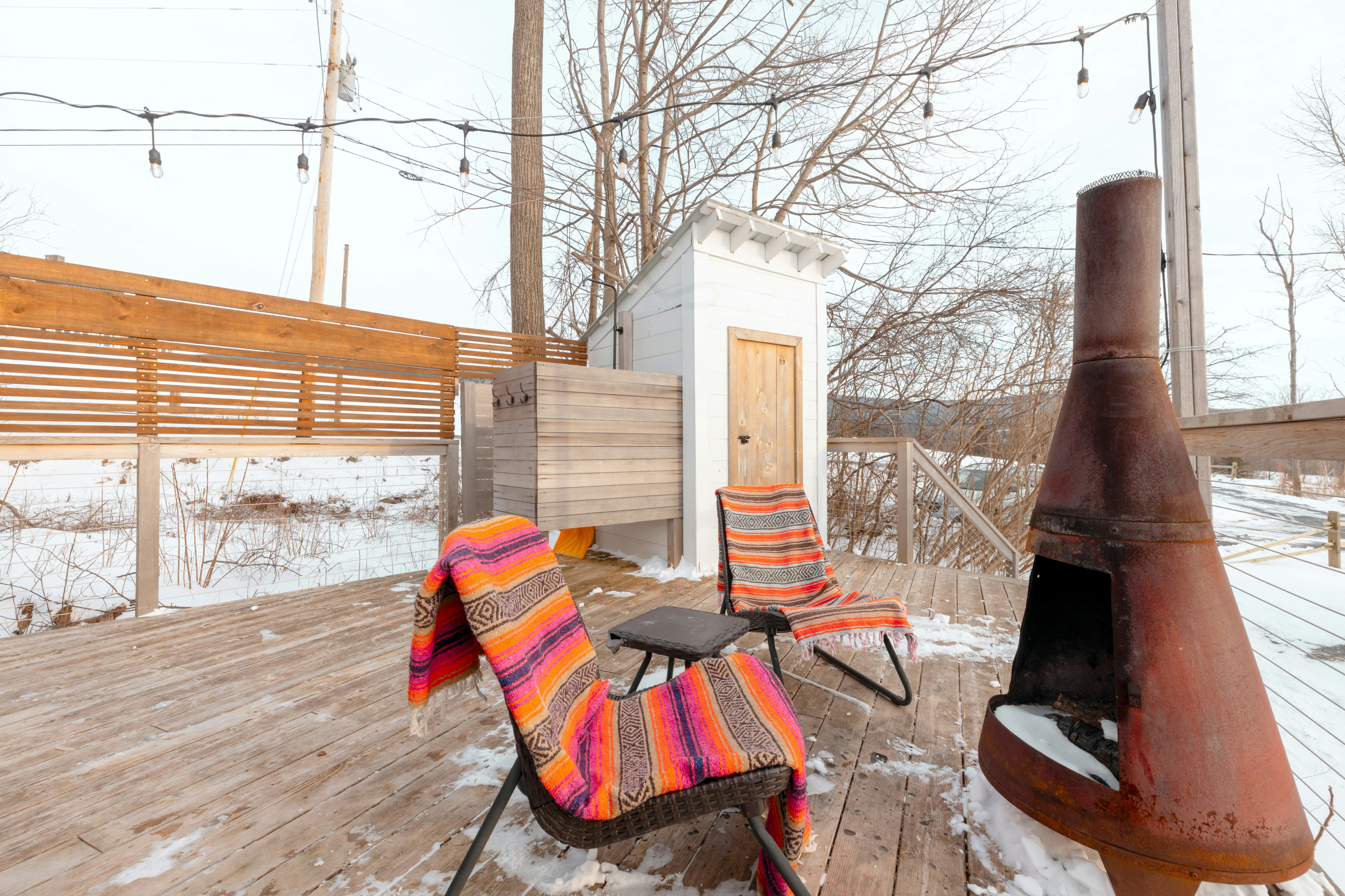 Cozy Winter Deck — Orange-Chair Companions by the Fire