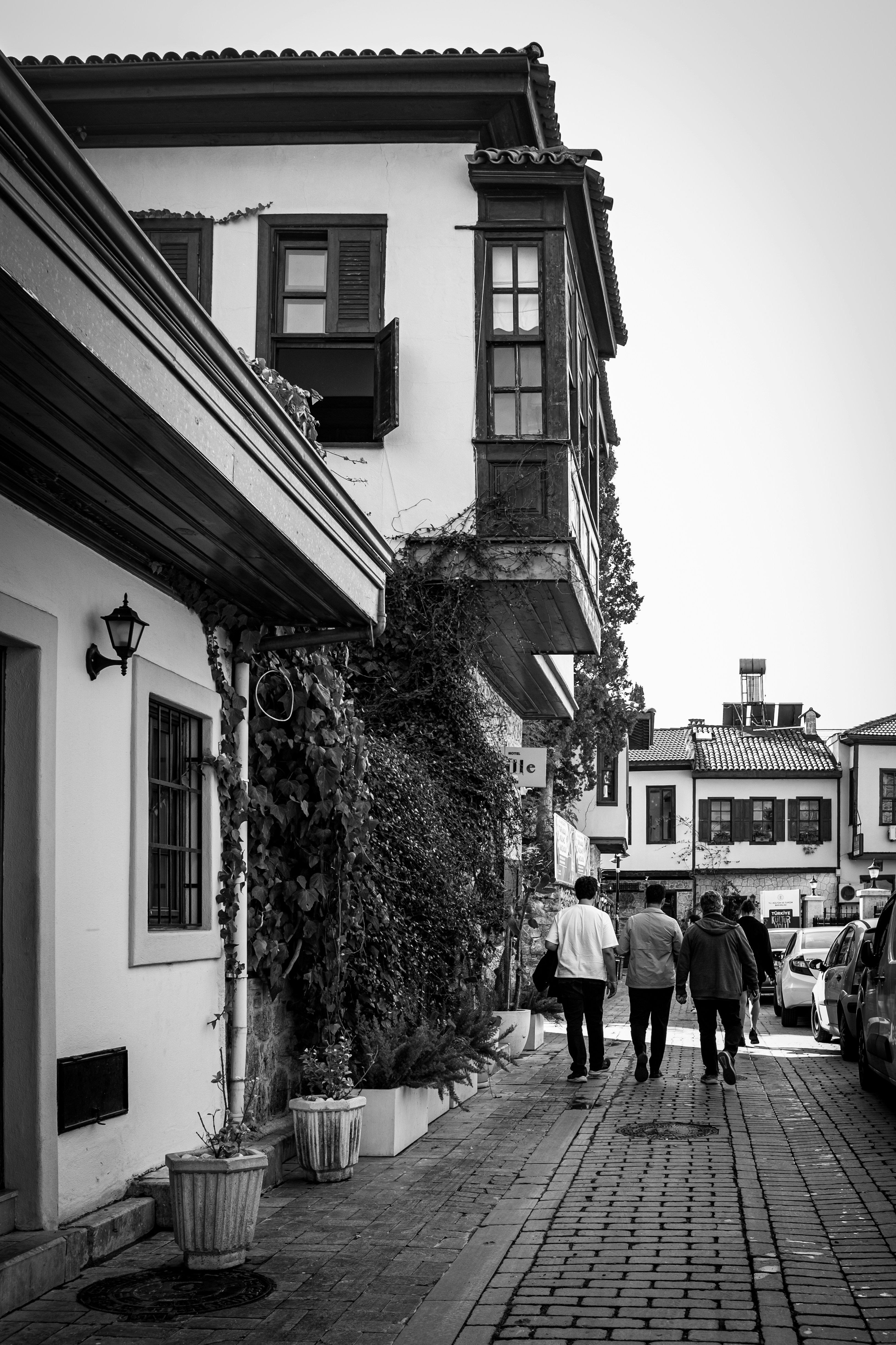 Cobbled Street Convergence: Quiet Walk Through a European Arcade