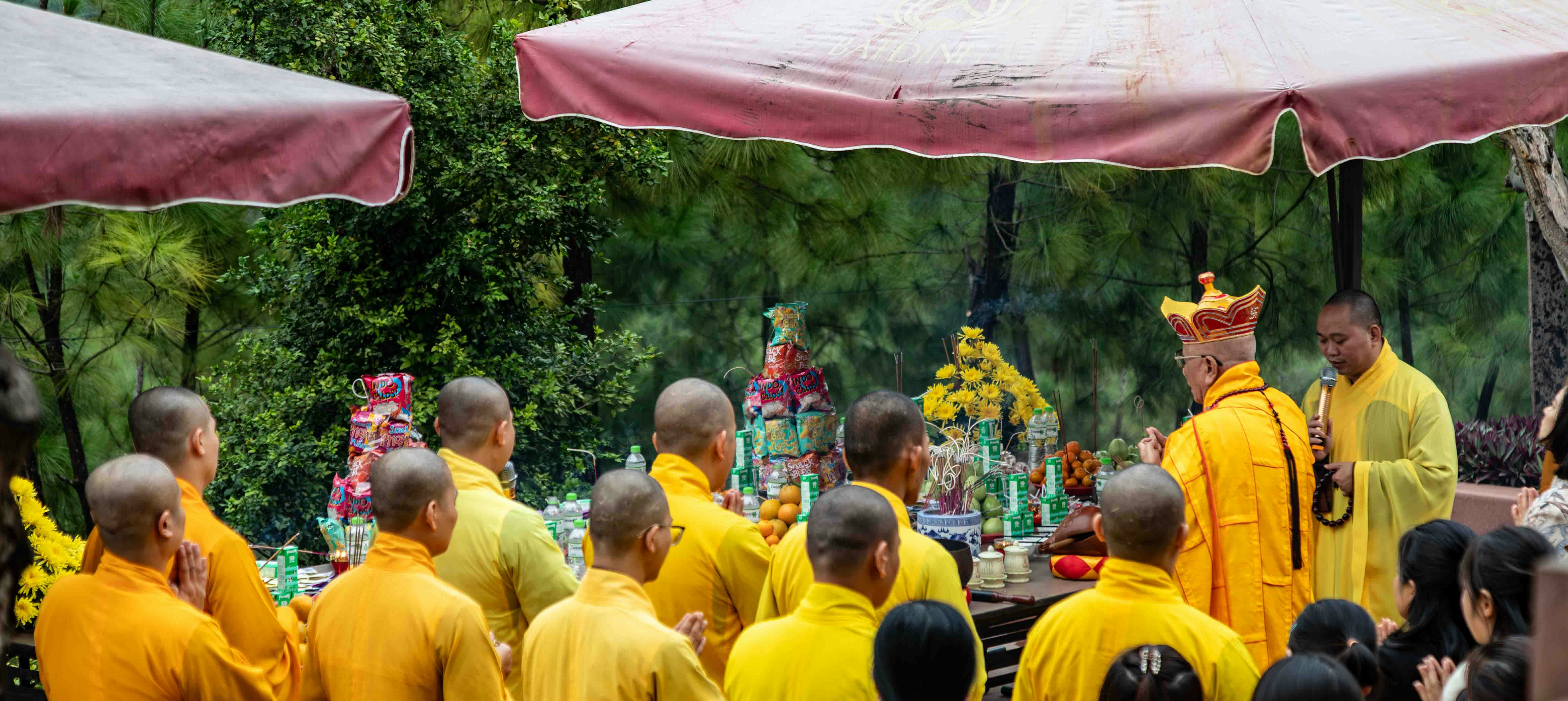 Monastic Assembly Under Umbrellas: Bright Robes and Ritual at a Temple Courtyard