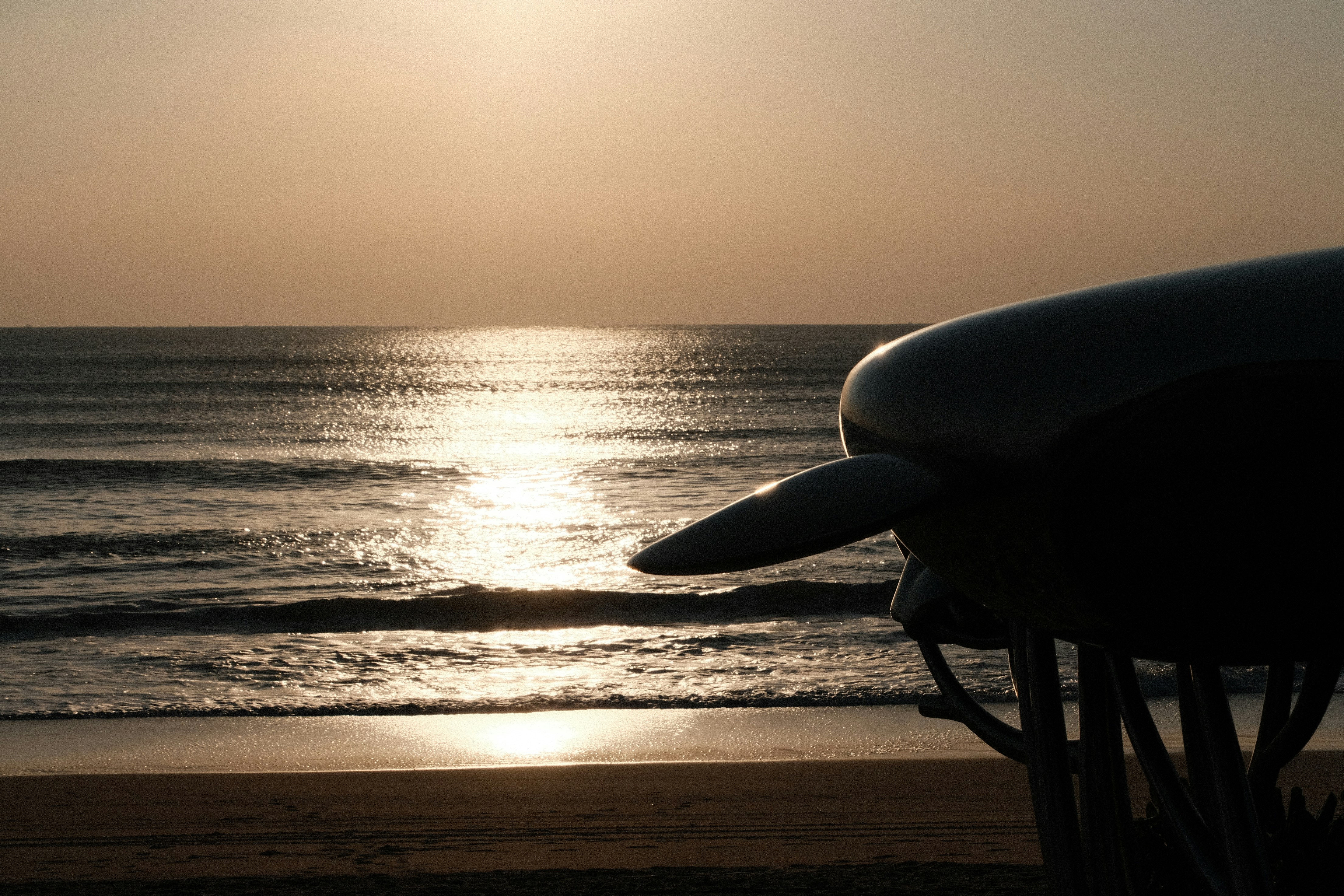 Silhouette of a Surfboard Rack at Sunset Beach