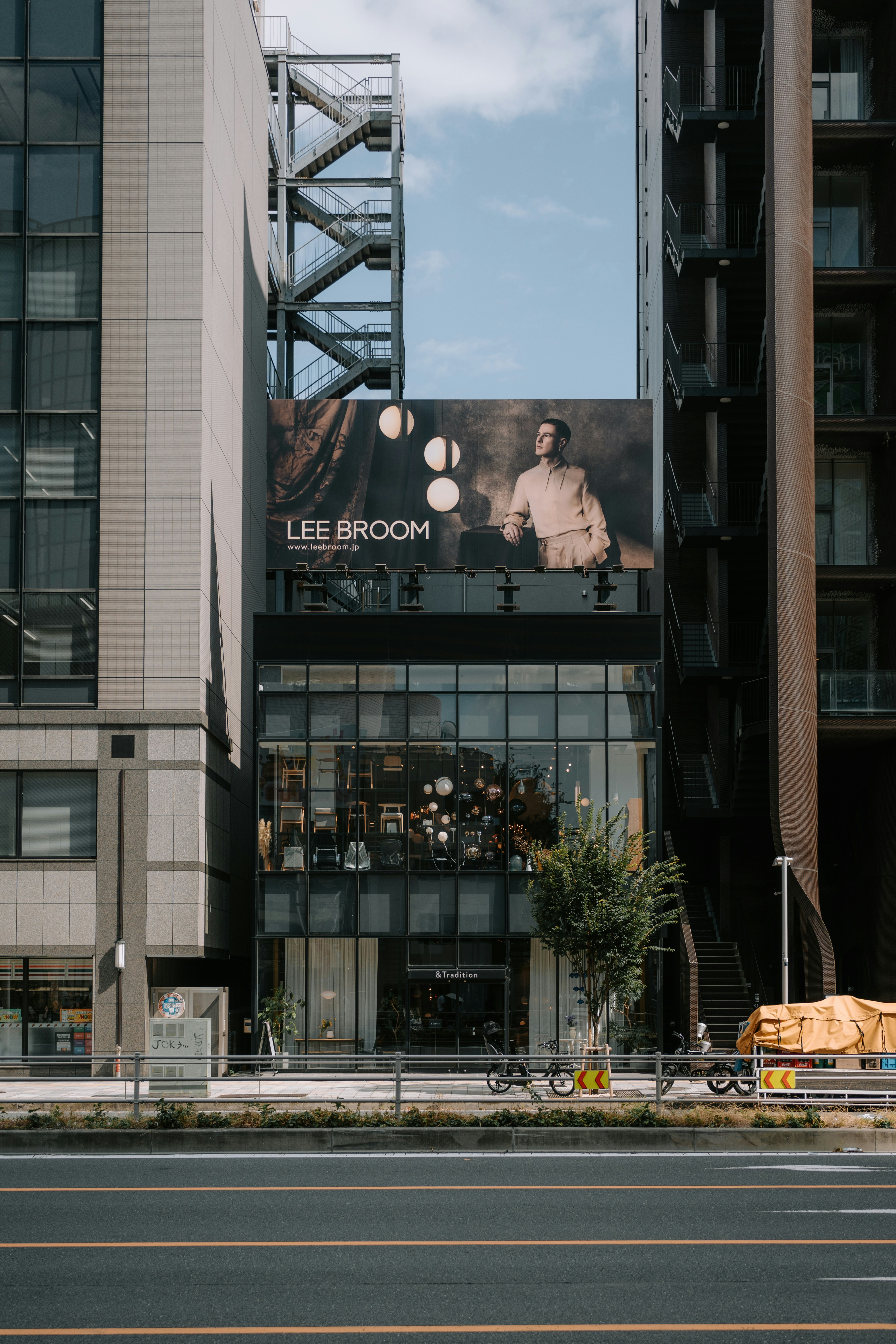 Billboard Beacon: Fashion House Signage Ad Anchored Between Glassy Towers