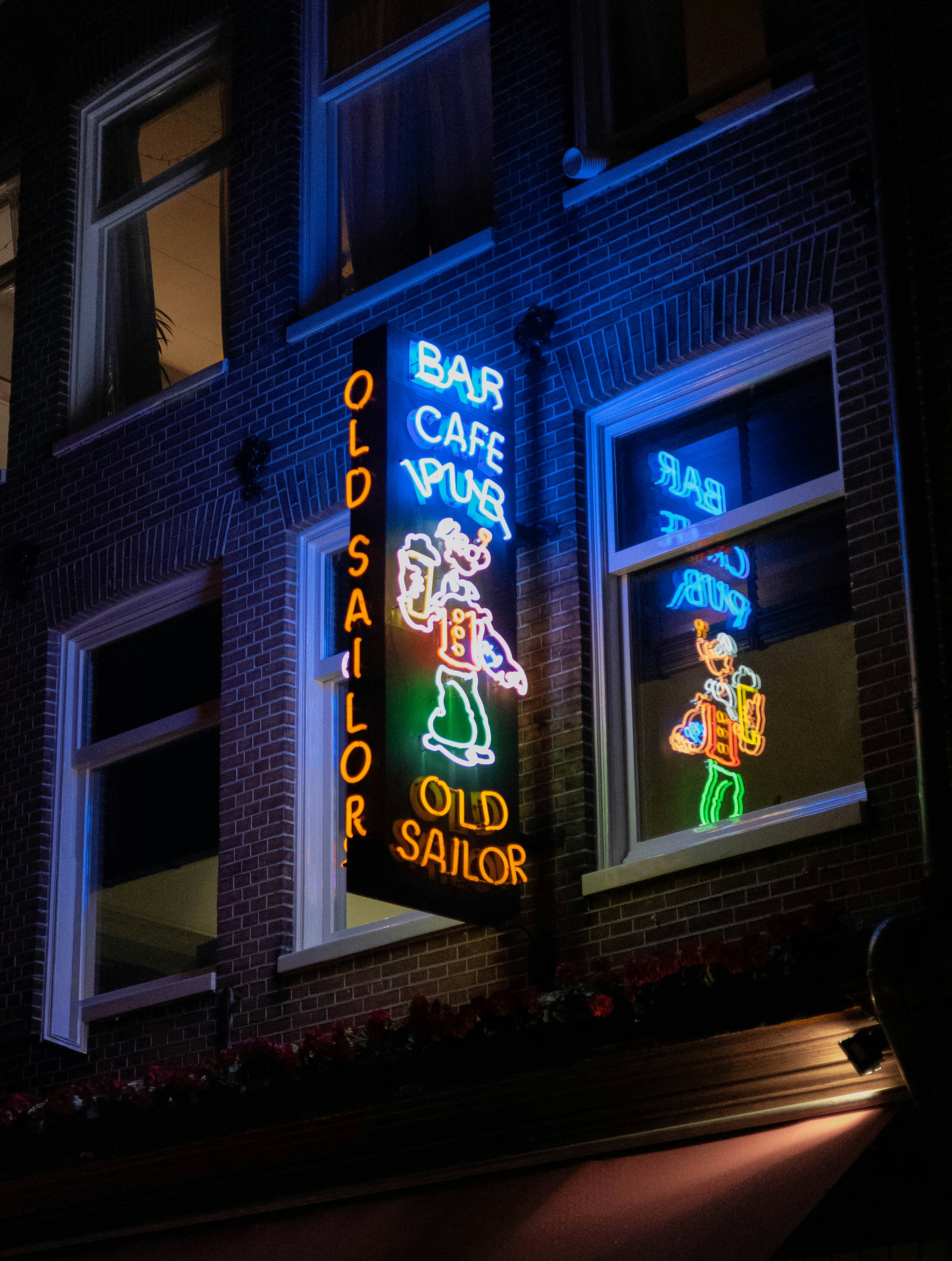 Neon Sign Reflections: A Night at the Old Sailor Bar