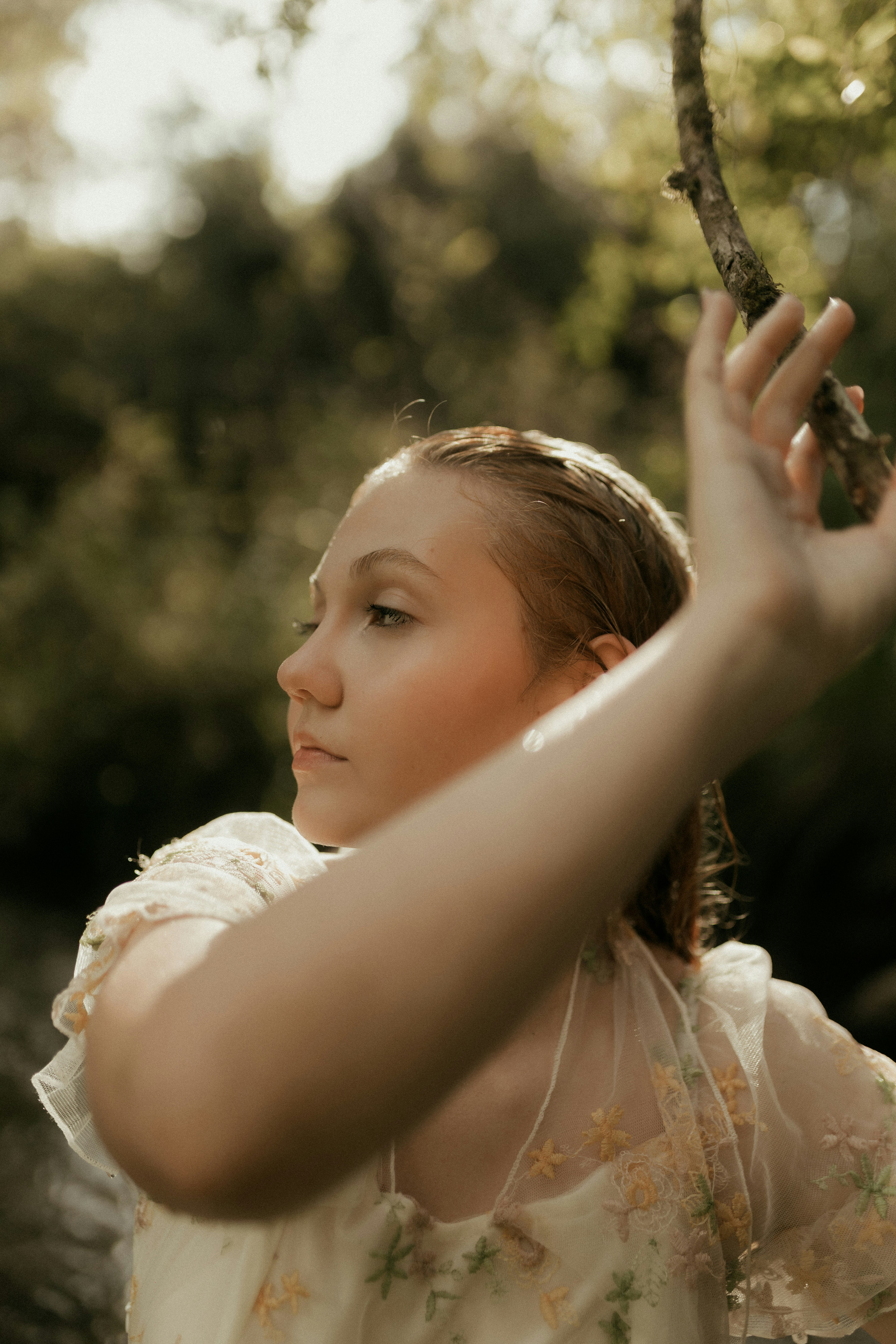 Soft Portrait in Dappled Light with Raised Arm Frame