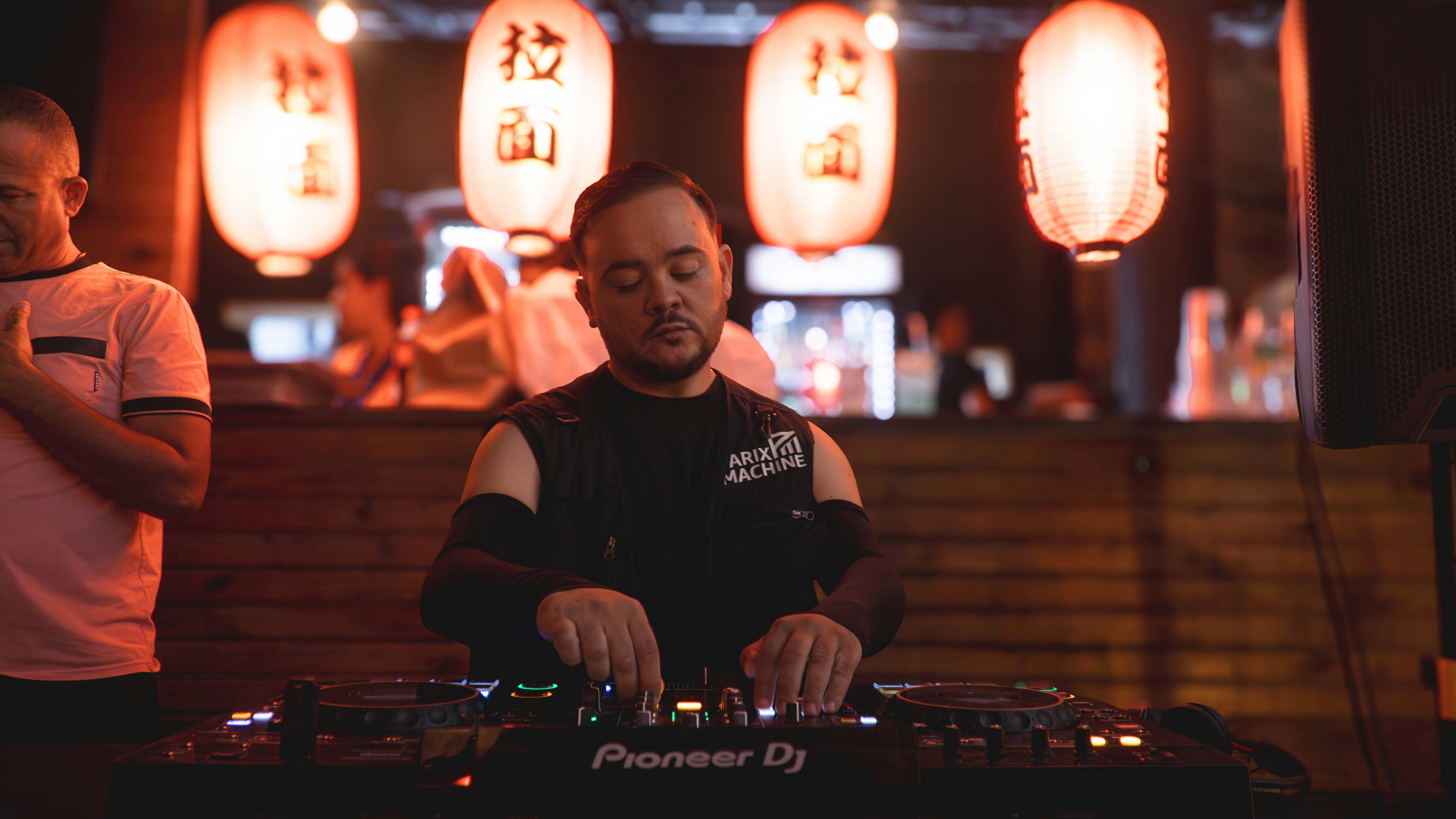 Midnight Pulse: DJ Spins Under Glowing Lanterns