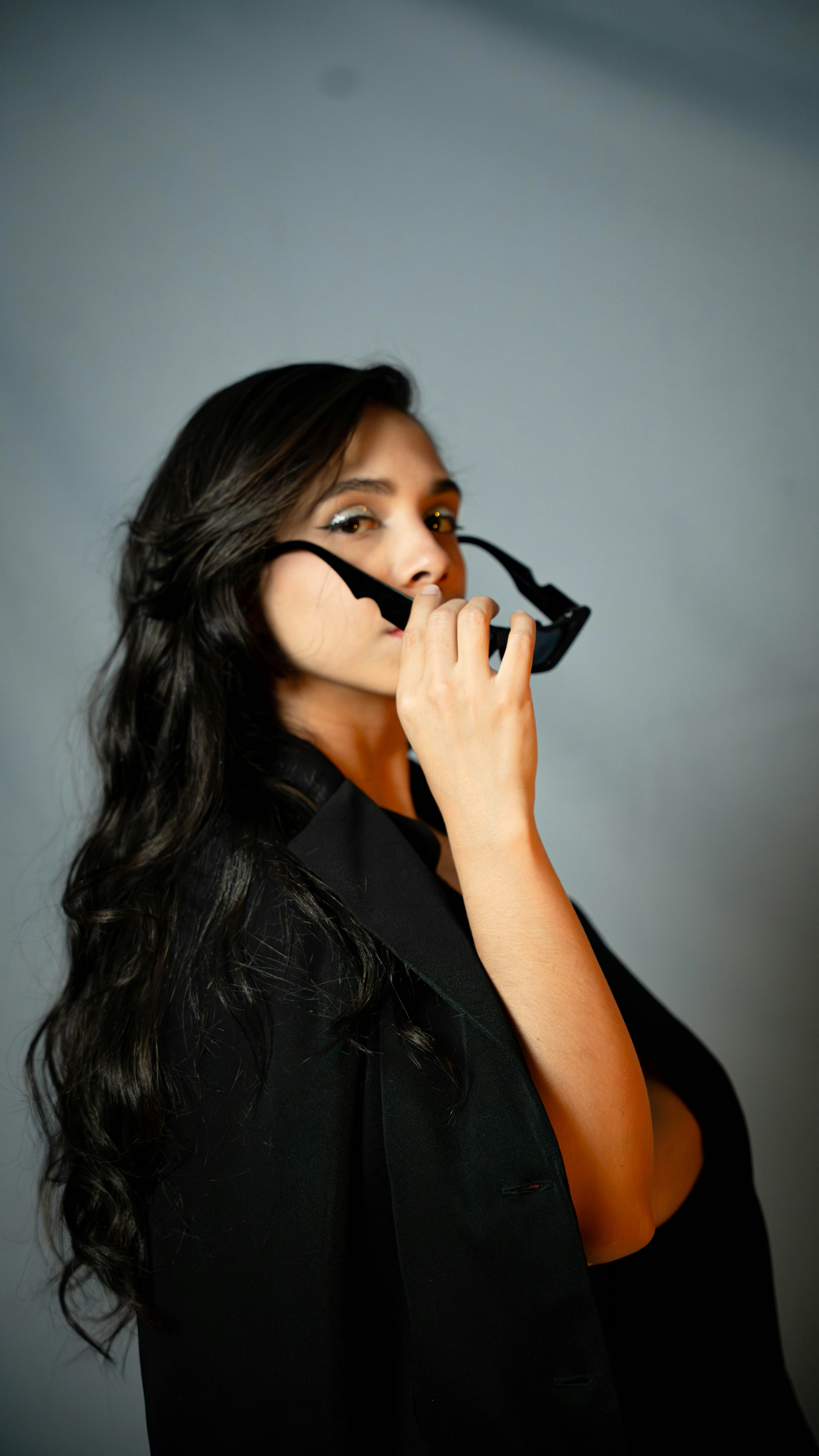 Masking Confidence: A Portrait in Shadow and Glass