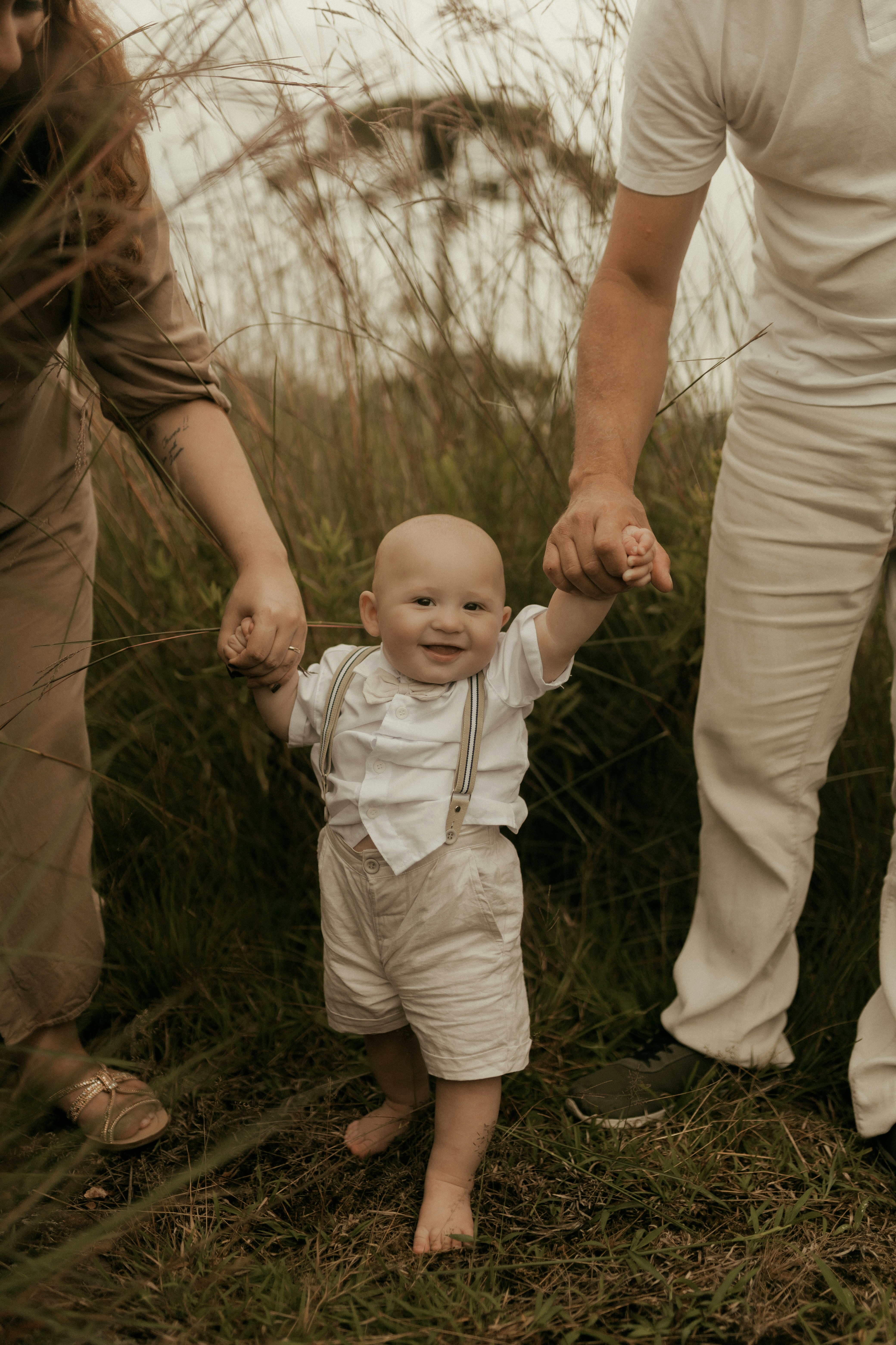 Tiny Explorer Holds Big Hands: A Family Walk in the Tall Grass
