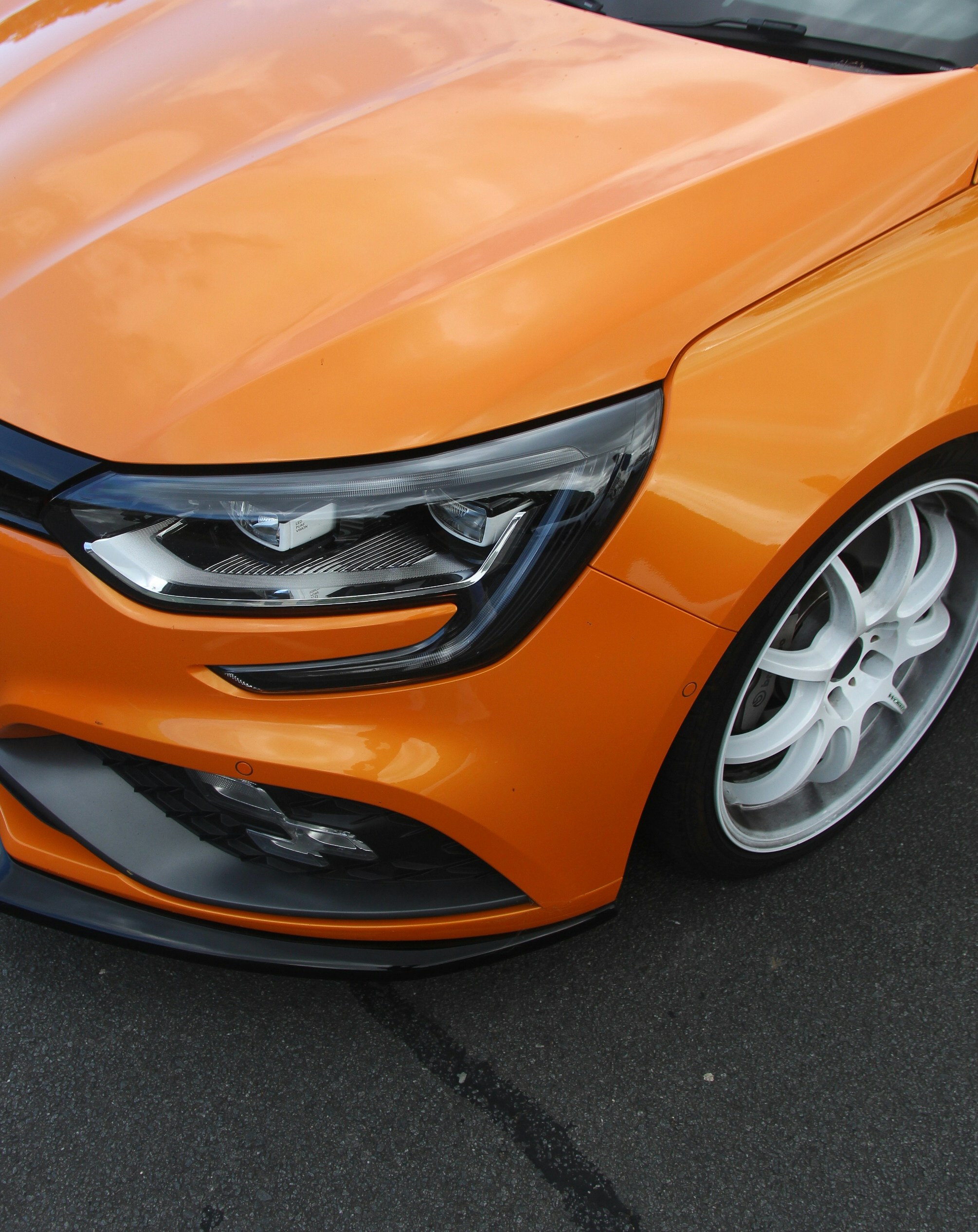 Low-Angle Orange Velocity: The Car’s Aggressive Front