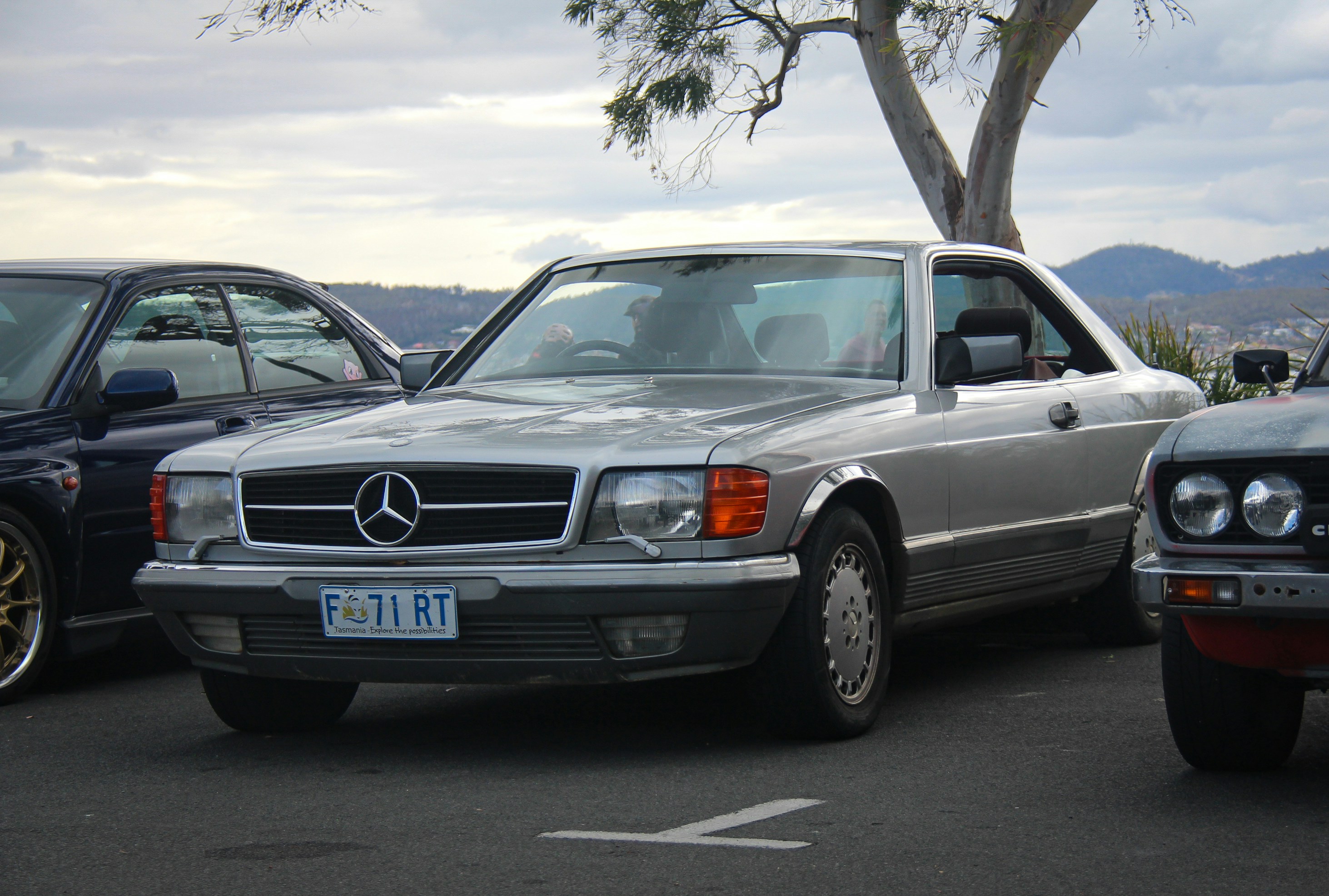 Chrome Crowned Merc in a Parking Lot Standstill