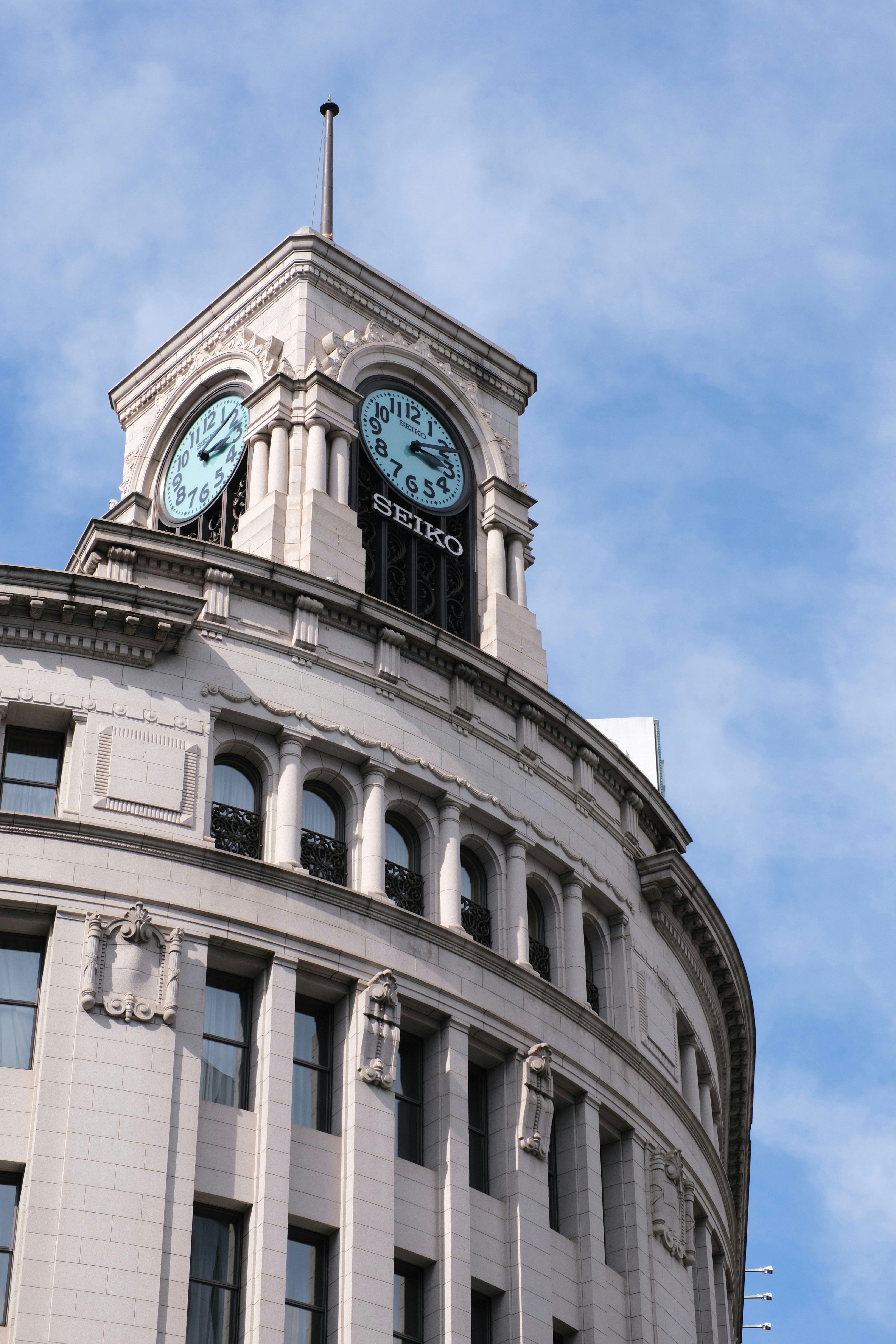 Clocktower with Blue Skies and Classical Facade