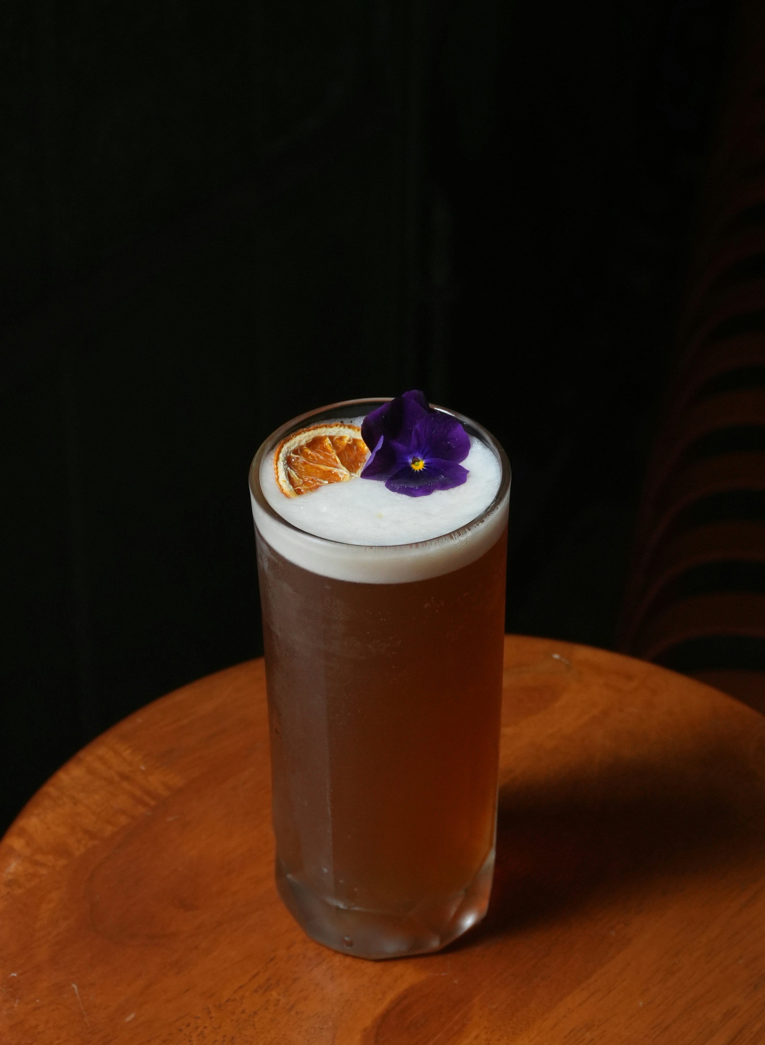 Low-lit Delicacy: A Velvet Cocktail on Wood