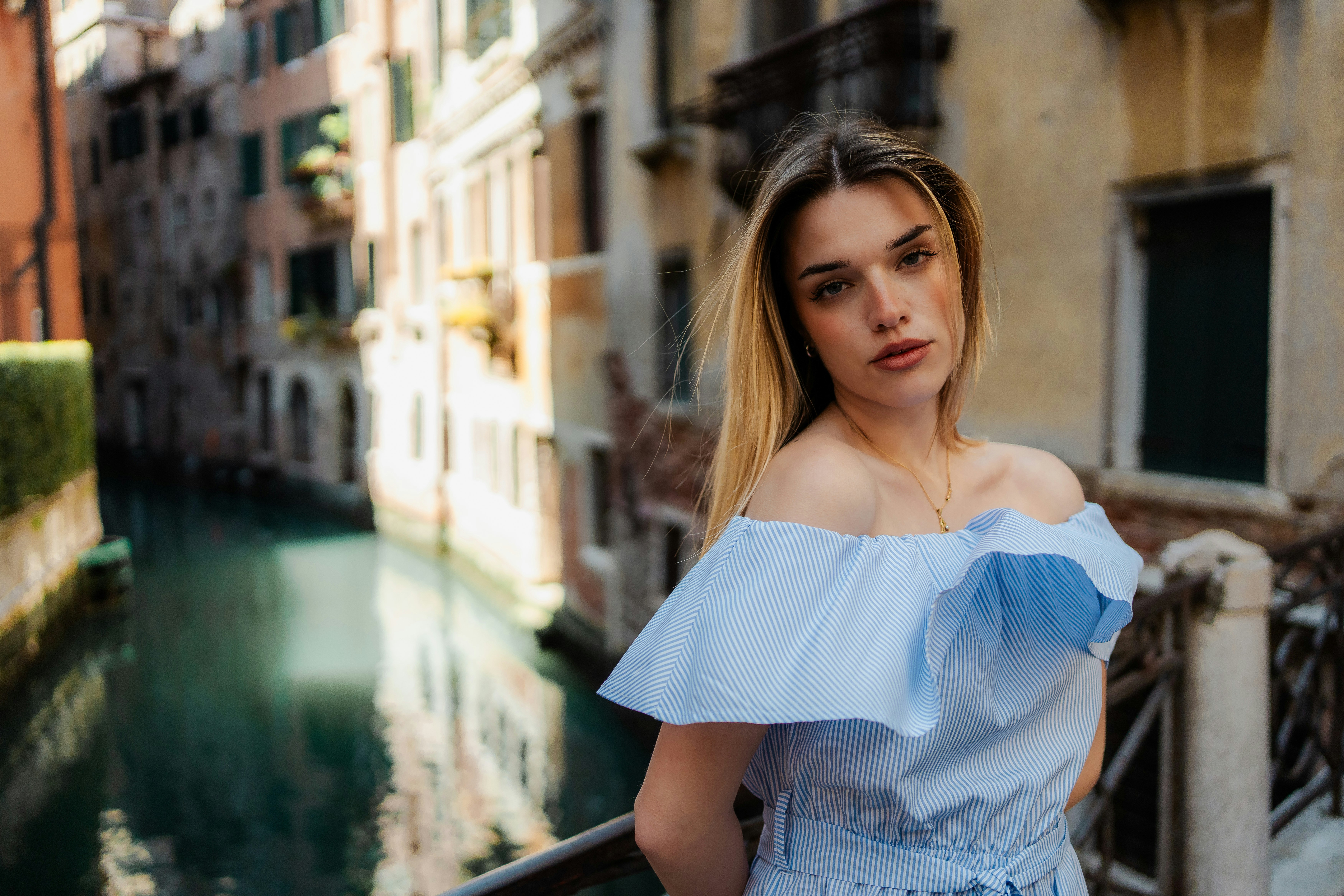 Quiet Confidence on a Canaled Venice Street