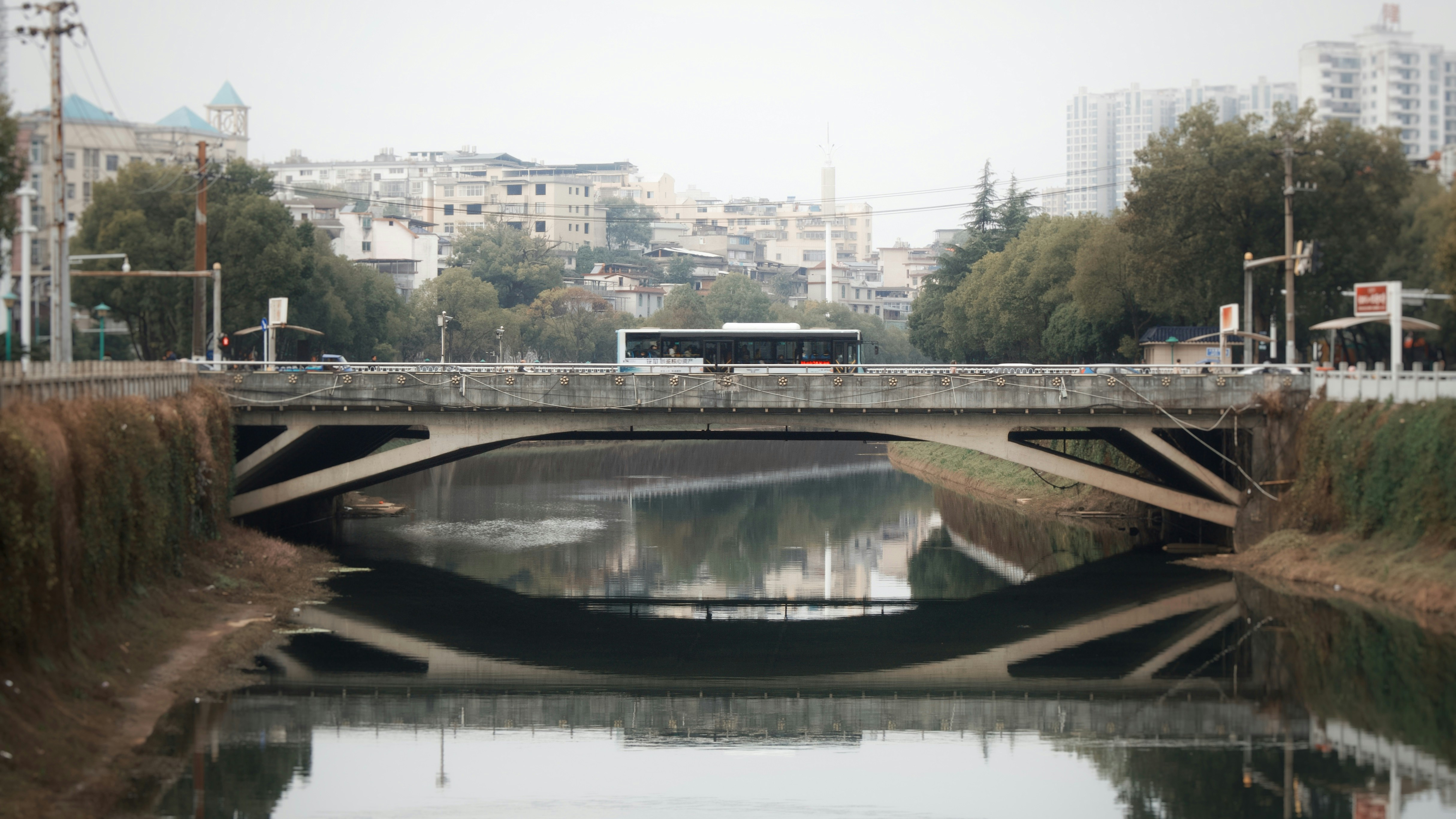 Bridge Reflections: Quiet Canal Beneath the City