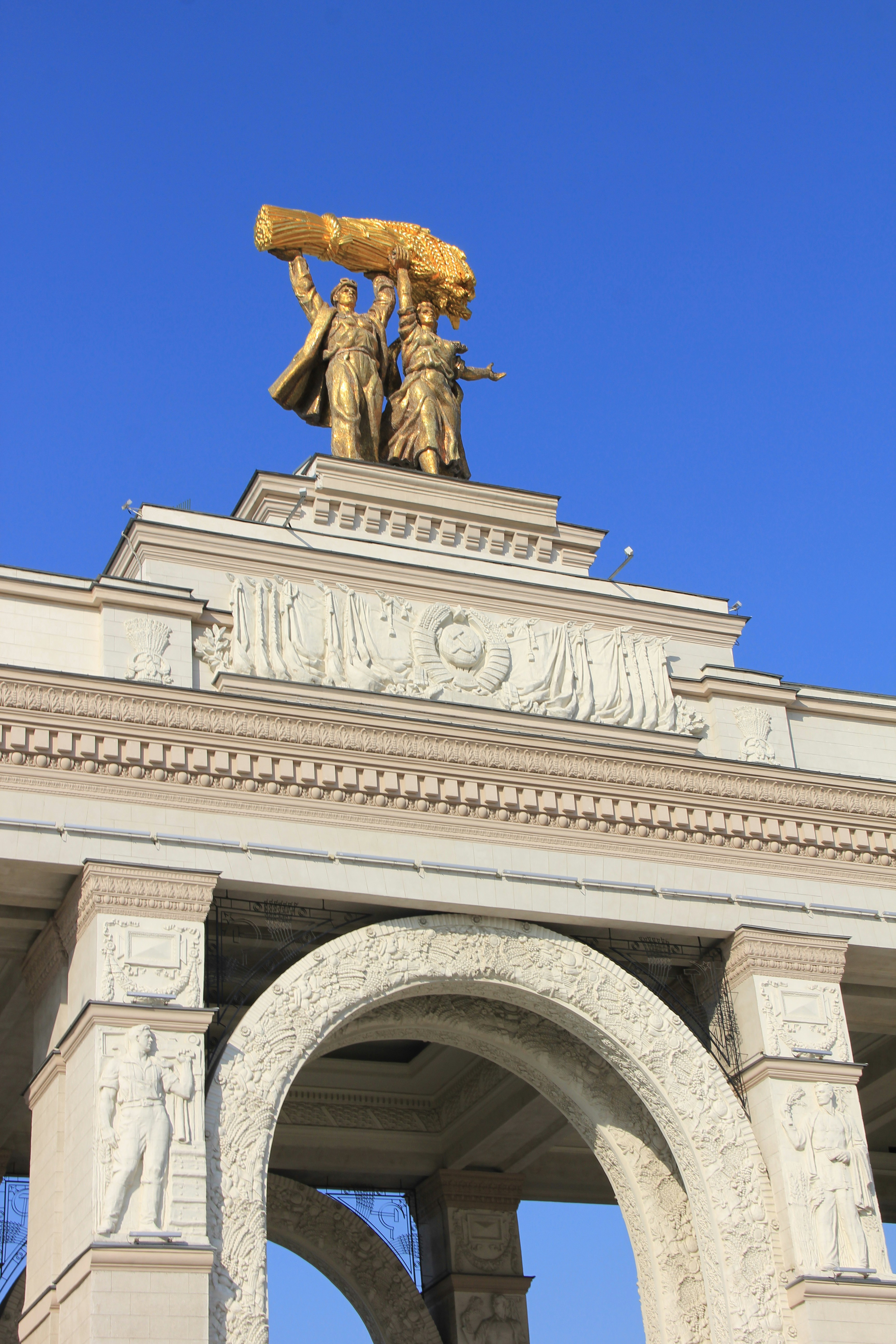 Winged Honor: The Golden Sculpture Above the Arch