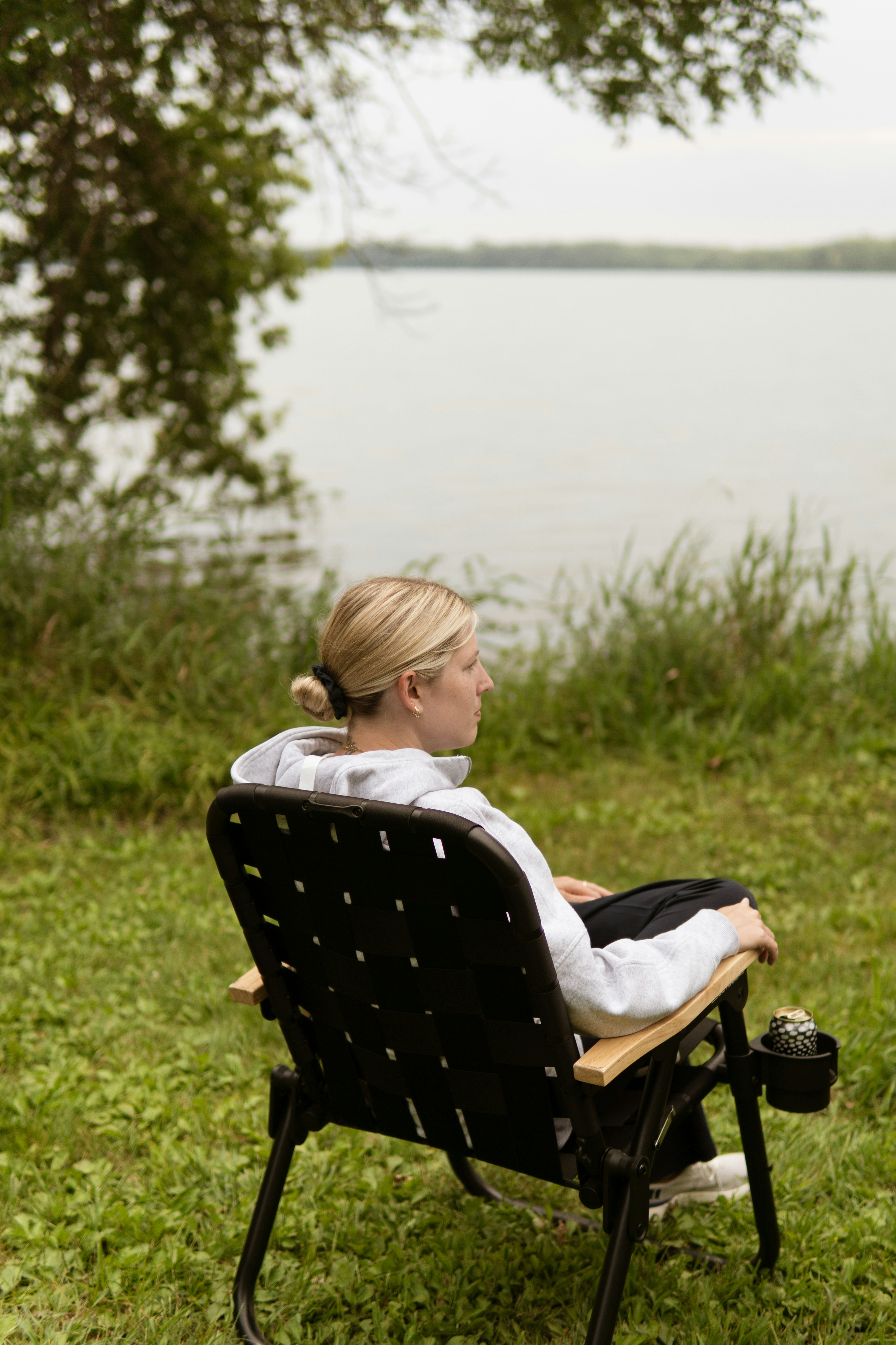 Lakeside Reverie: A Quiet Moment in the Grass