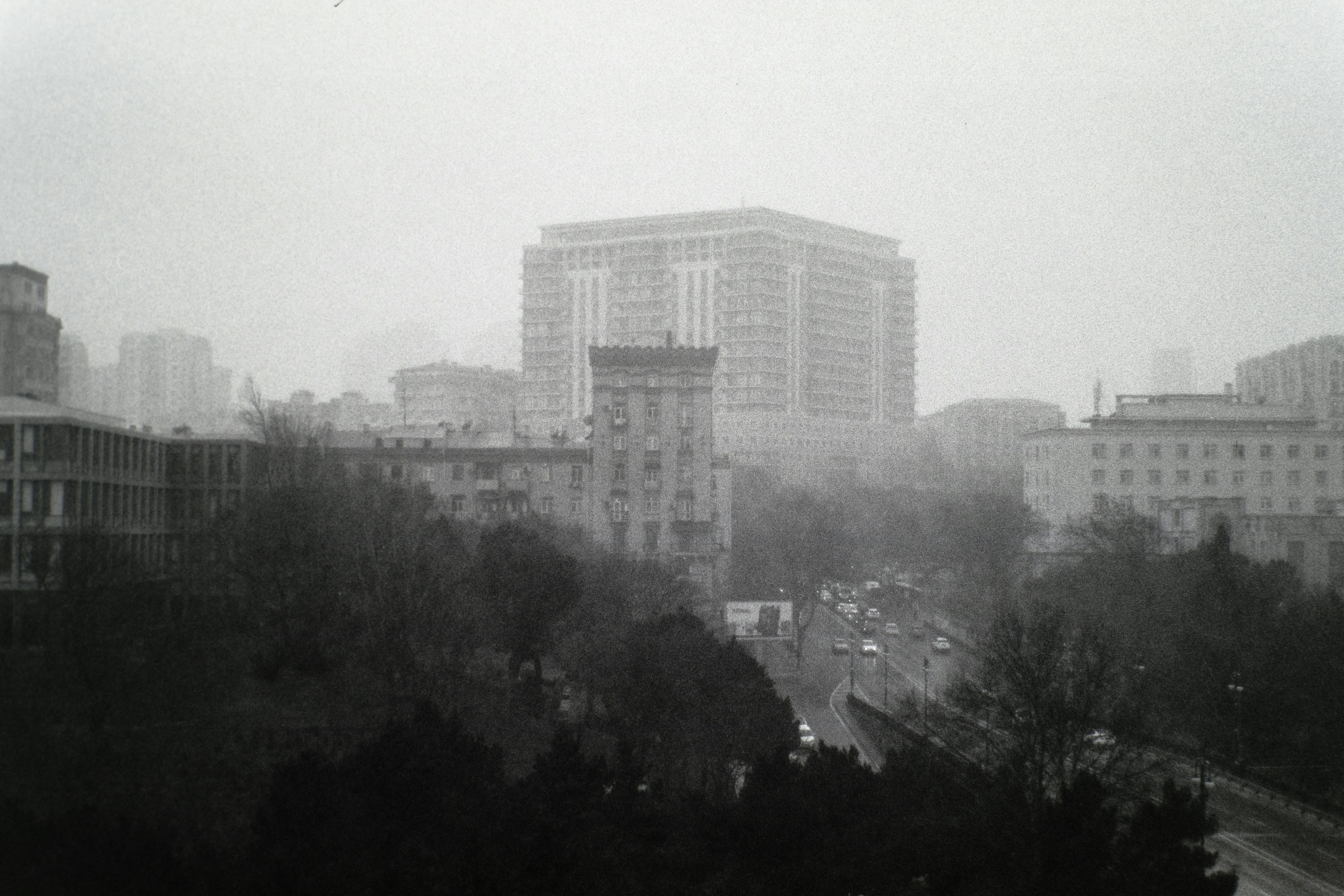Urban Silhouette from a Misty Overlook