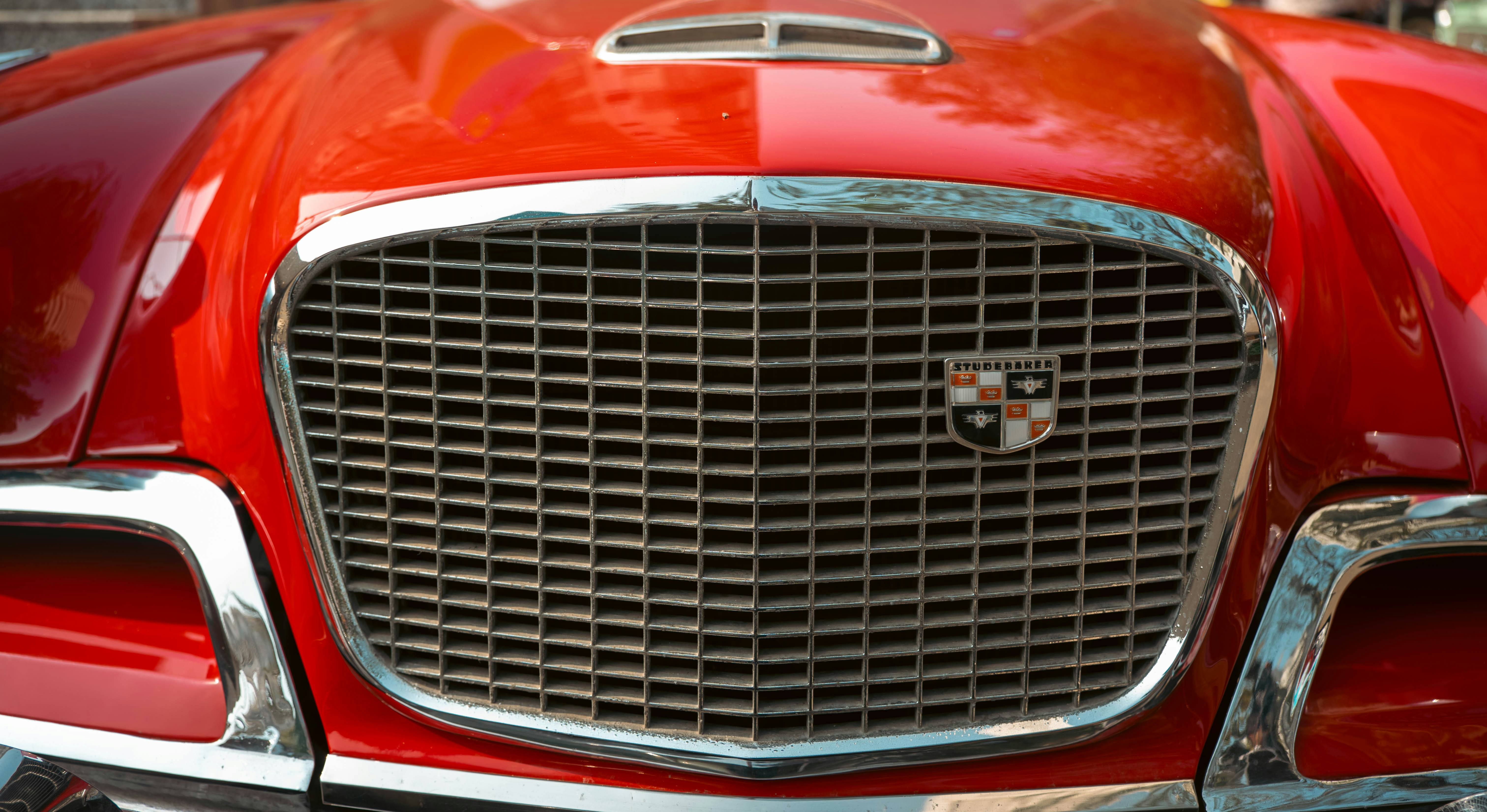 Close-up of a vintage red car grille